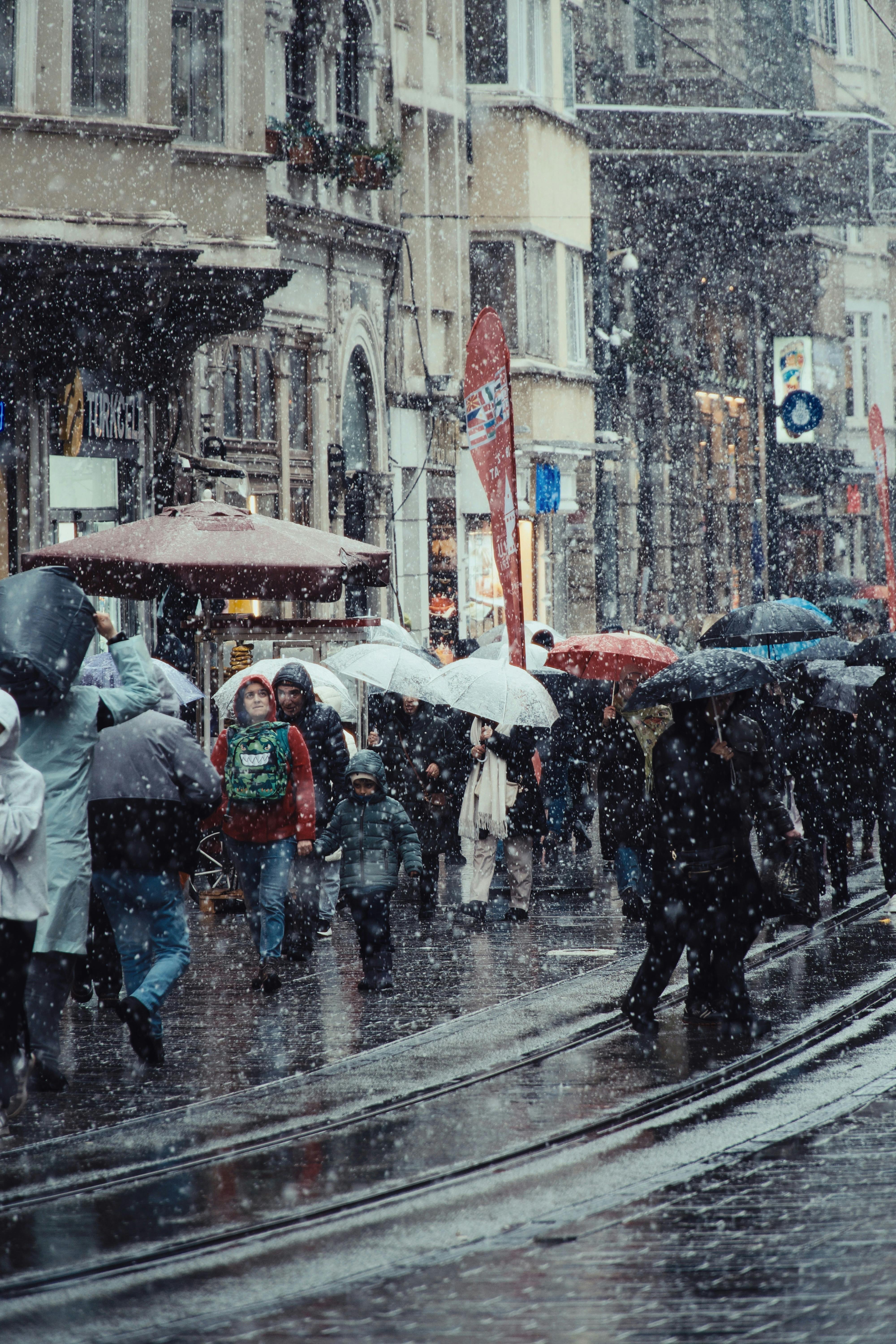 Busy Urban Street Scene in Snowy Weather · Free Stock Photo