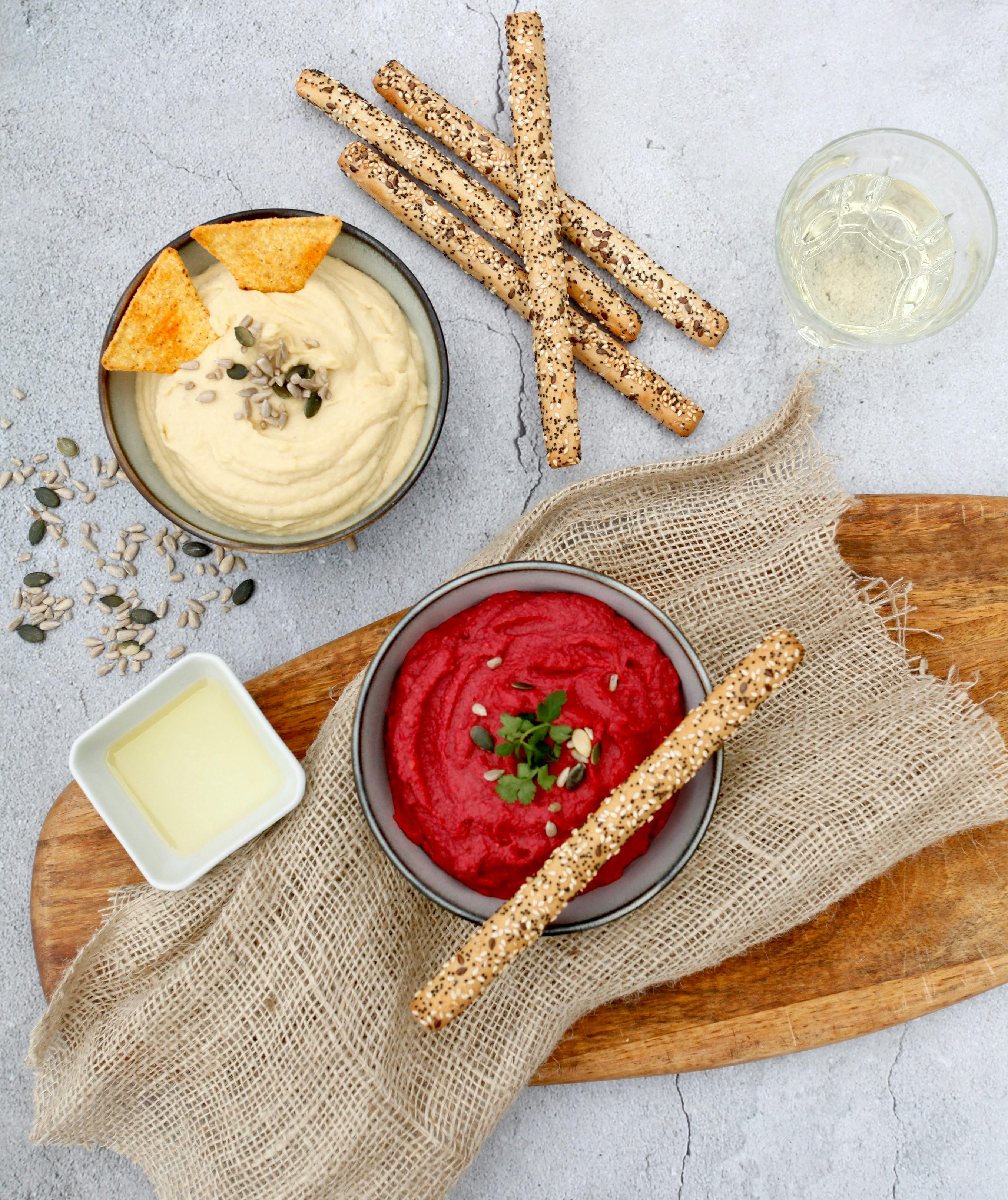 Colorful Hummus and Breadstick Arrangement · Free Stock Photo