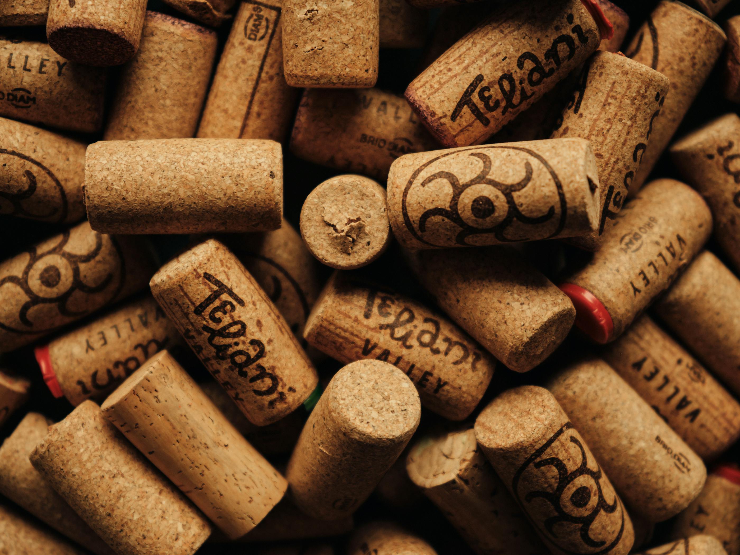 Pile of wooden stoppers with inscription · Free Stock Photo