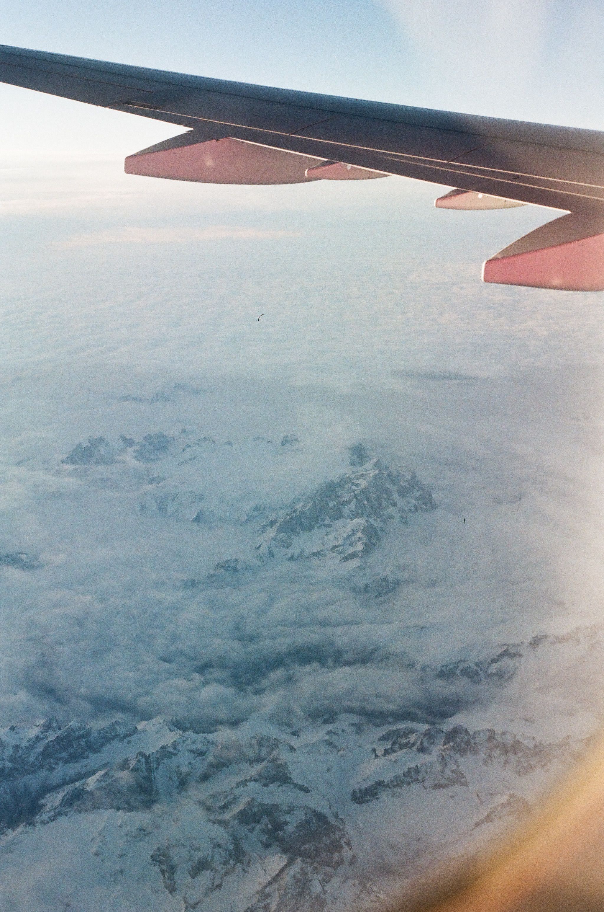 Aerial View of Snow-Covered Mountains from Airplane · Free Stock Photo
