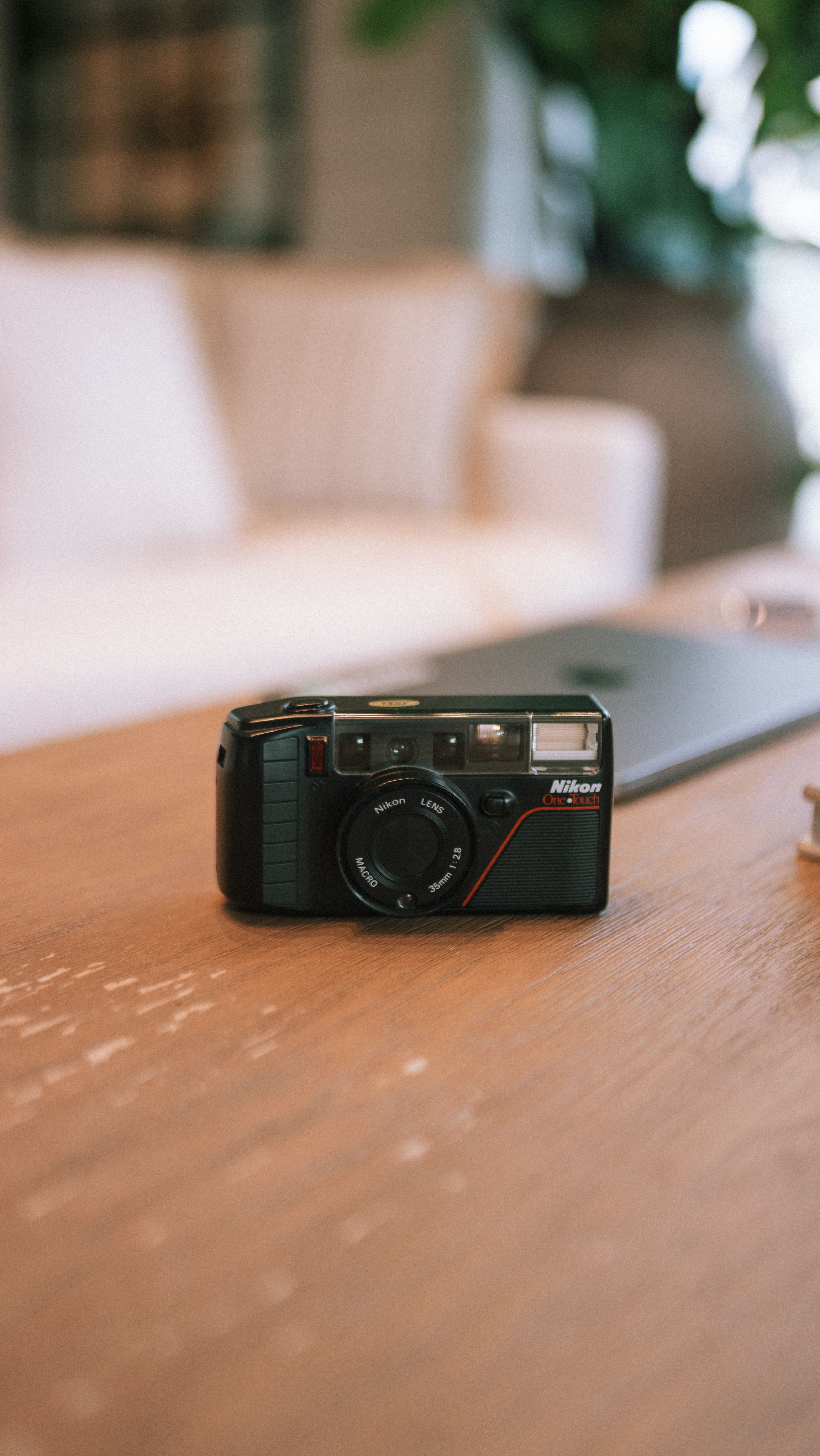 Black Canon Camera on White Wooden Table · Free Stock Photo