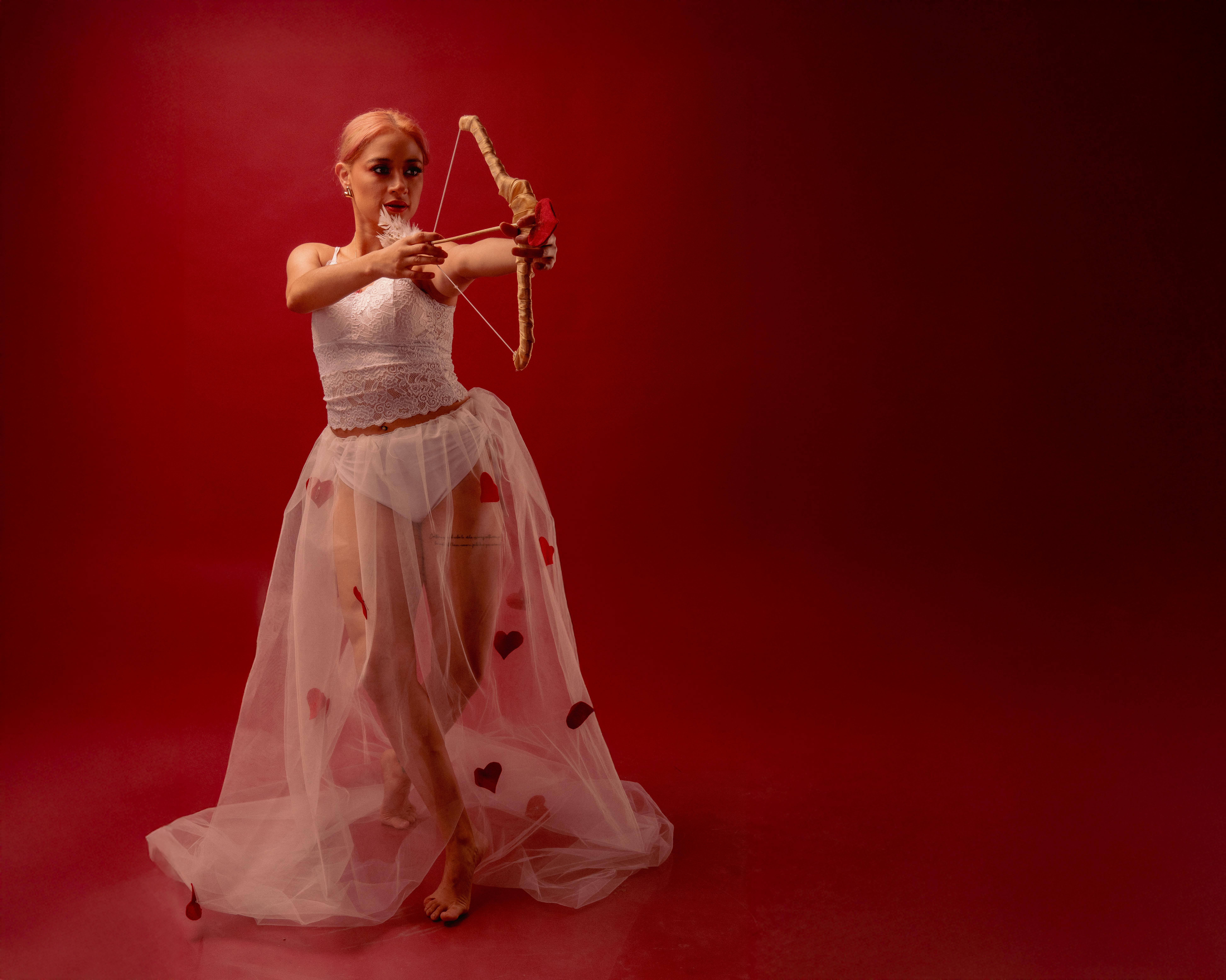 Artistic Portrait of Cupid in Red Backdrop · Free Stock Photo