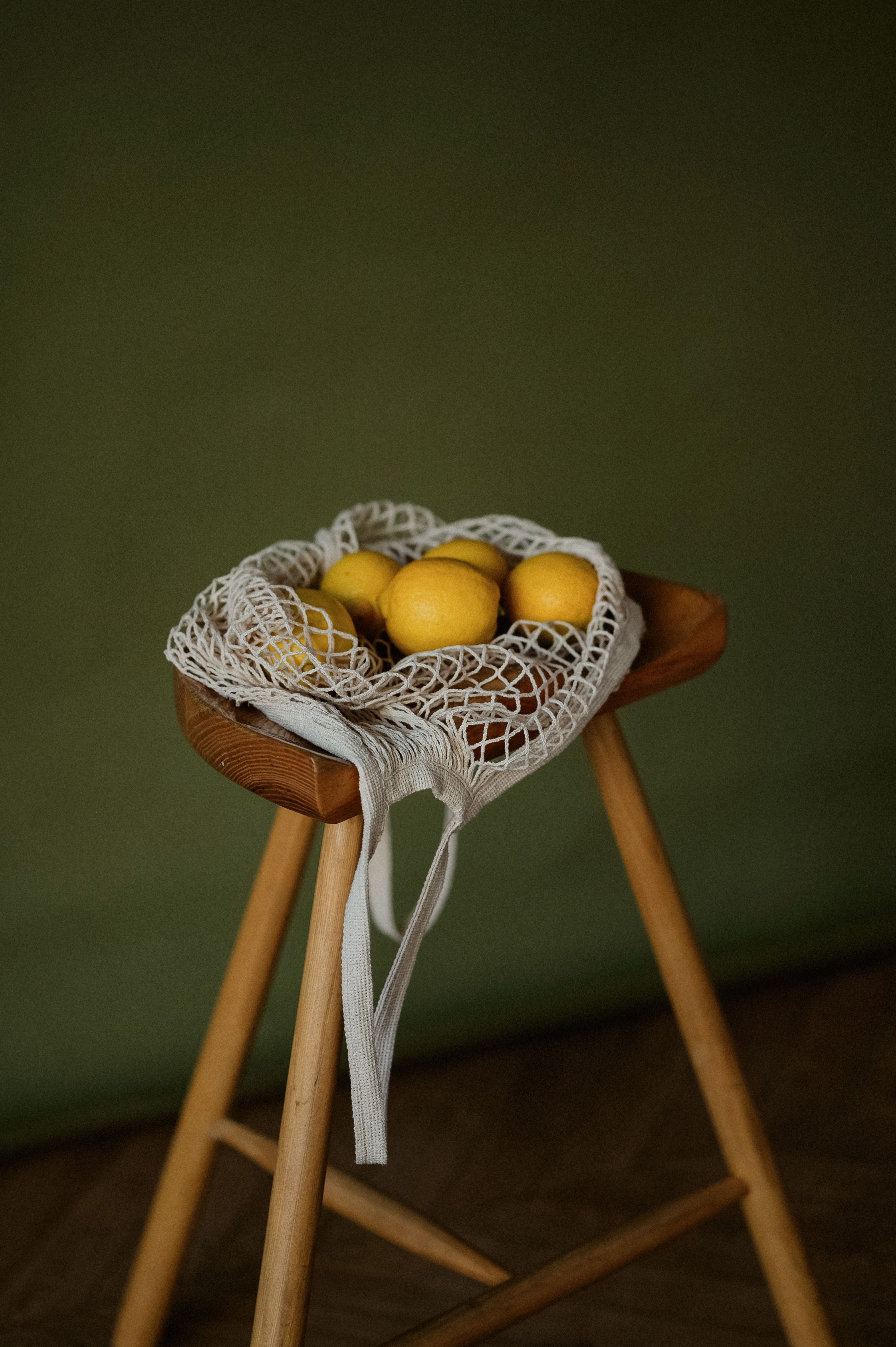 Rustic Lemons in Crochet Bag on Wooden Chair · Free Stock Photo