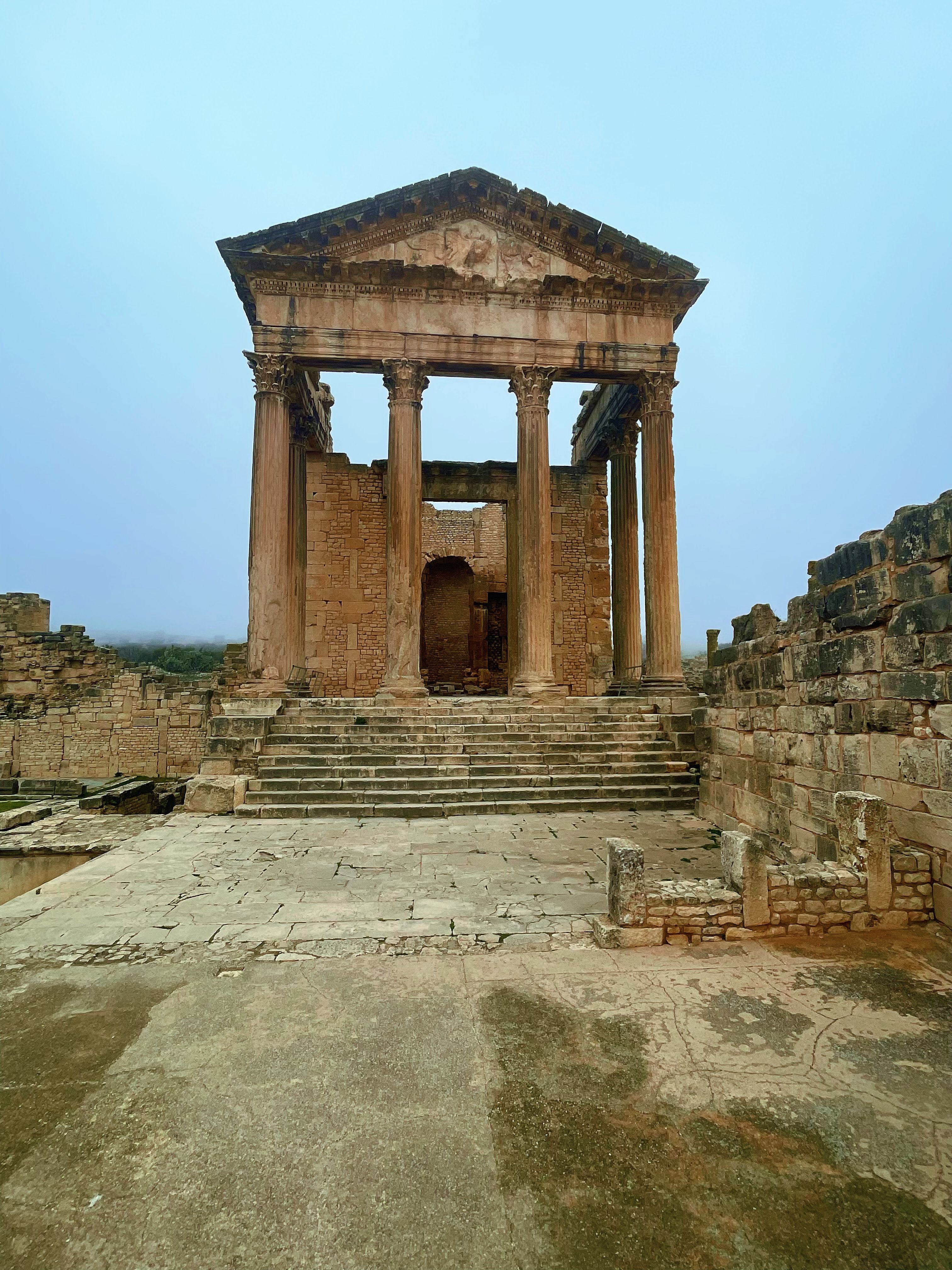 Ancient Roman Temple Ruins in Foggy Setting · Free Stock Photo