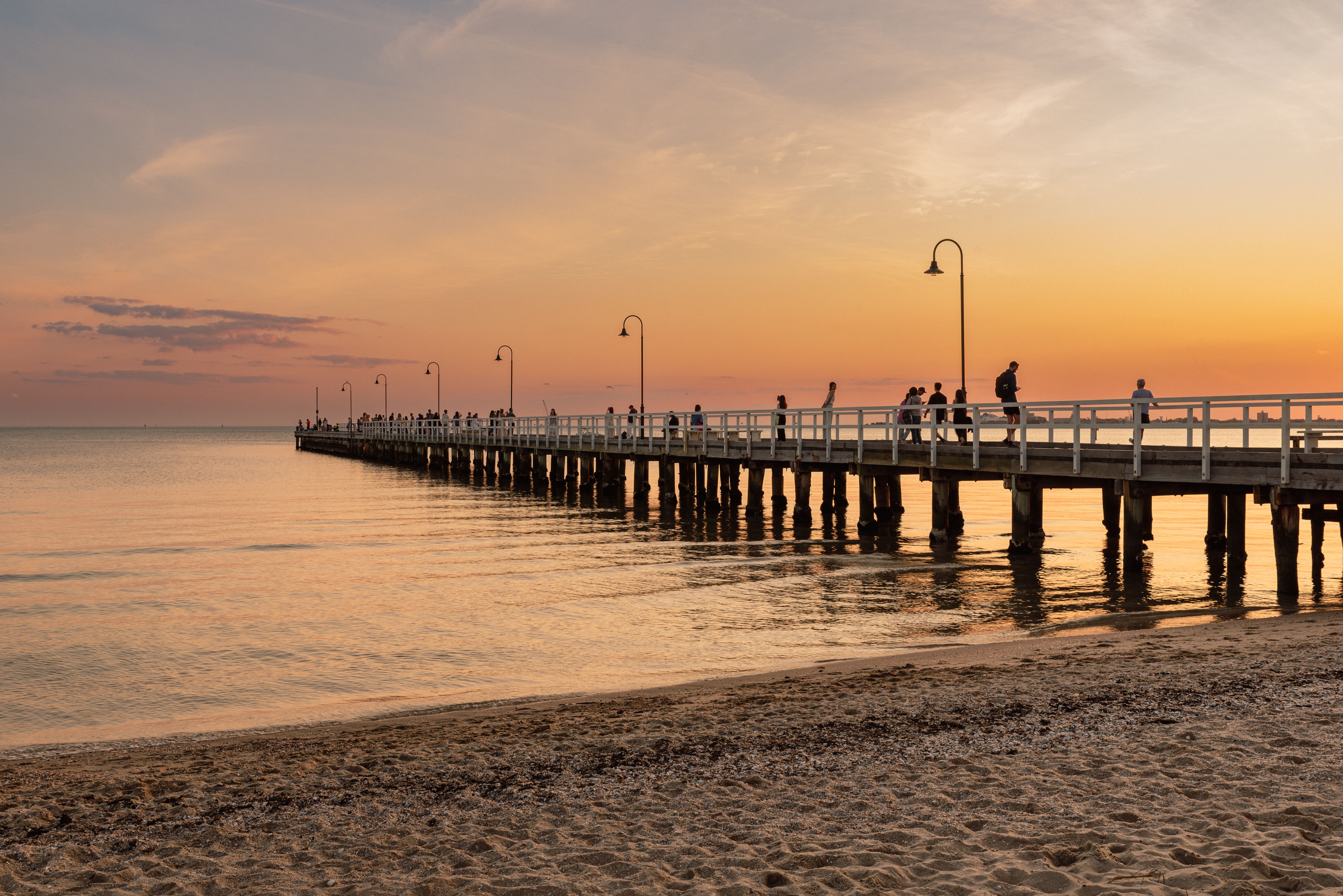 Scenic Sunset View of Seaside Pier and Beach · Free Stock Photo