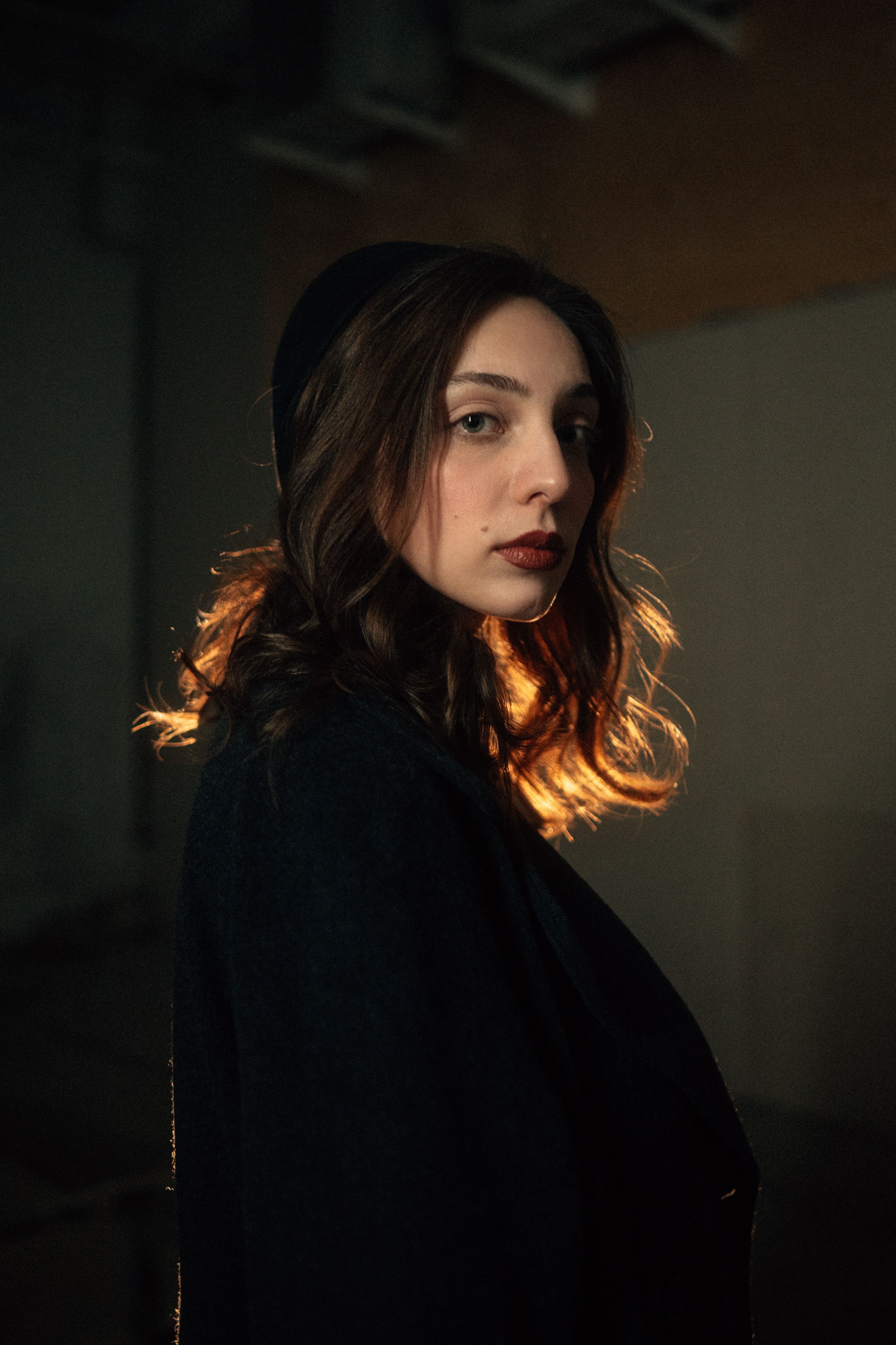 Moody Portrait of a Young Woman with Backlight · Free Stock Photo