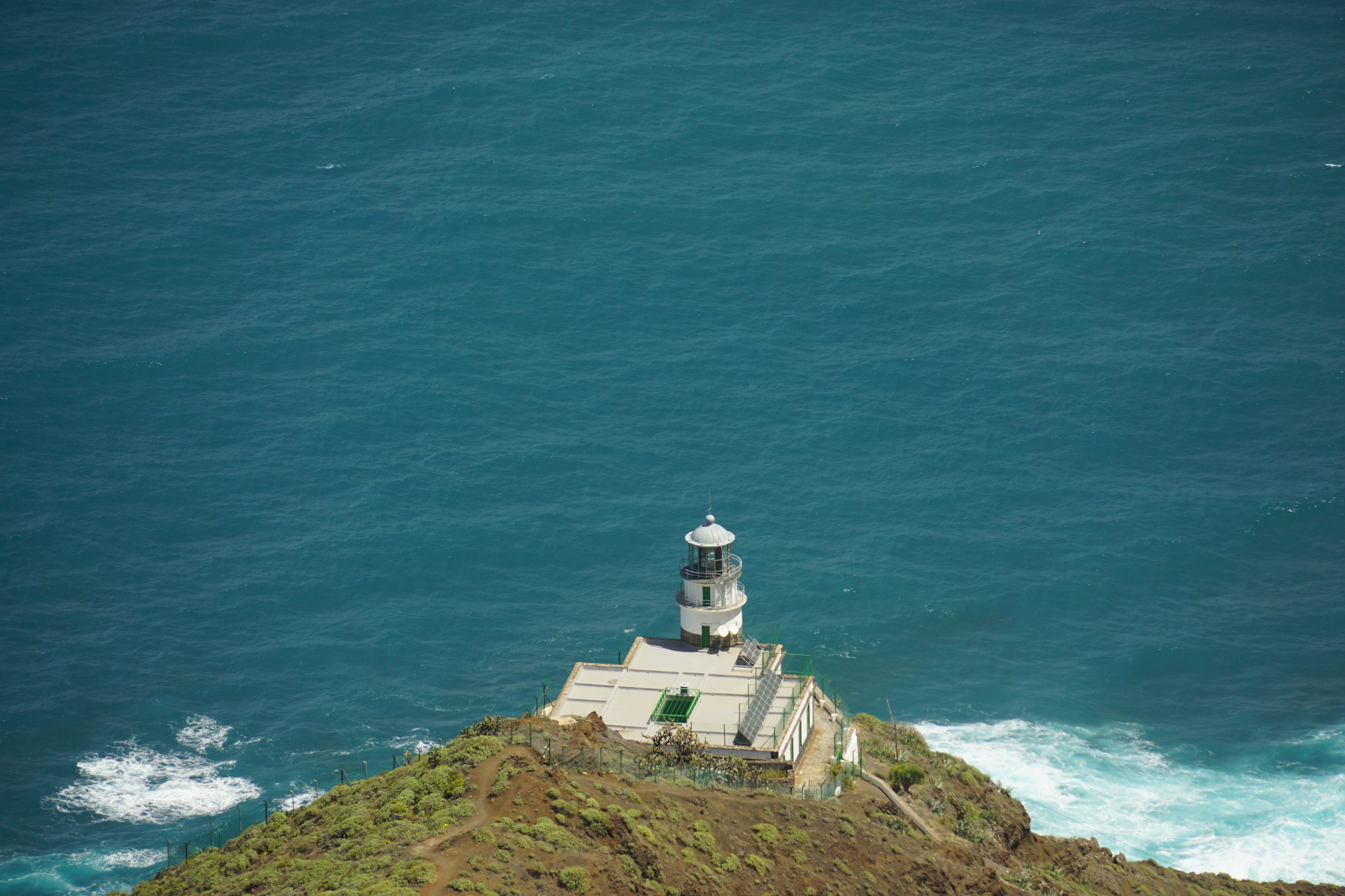 Scenic Aerial View of Coastal Lighthouse · Free Stock Photo