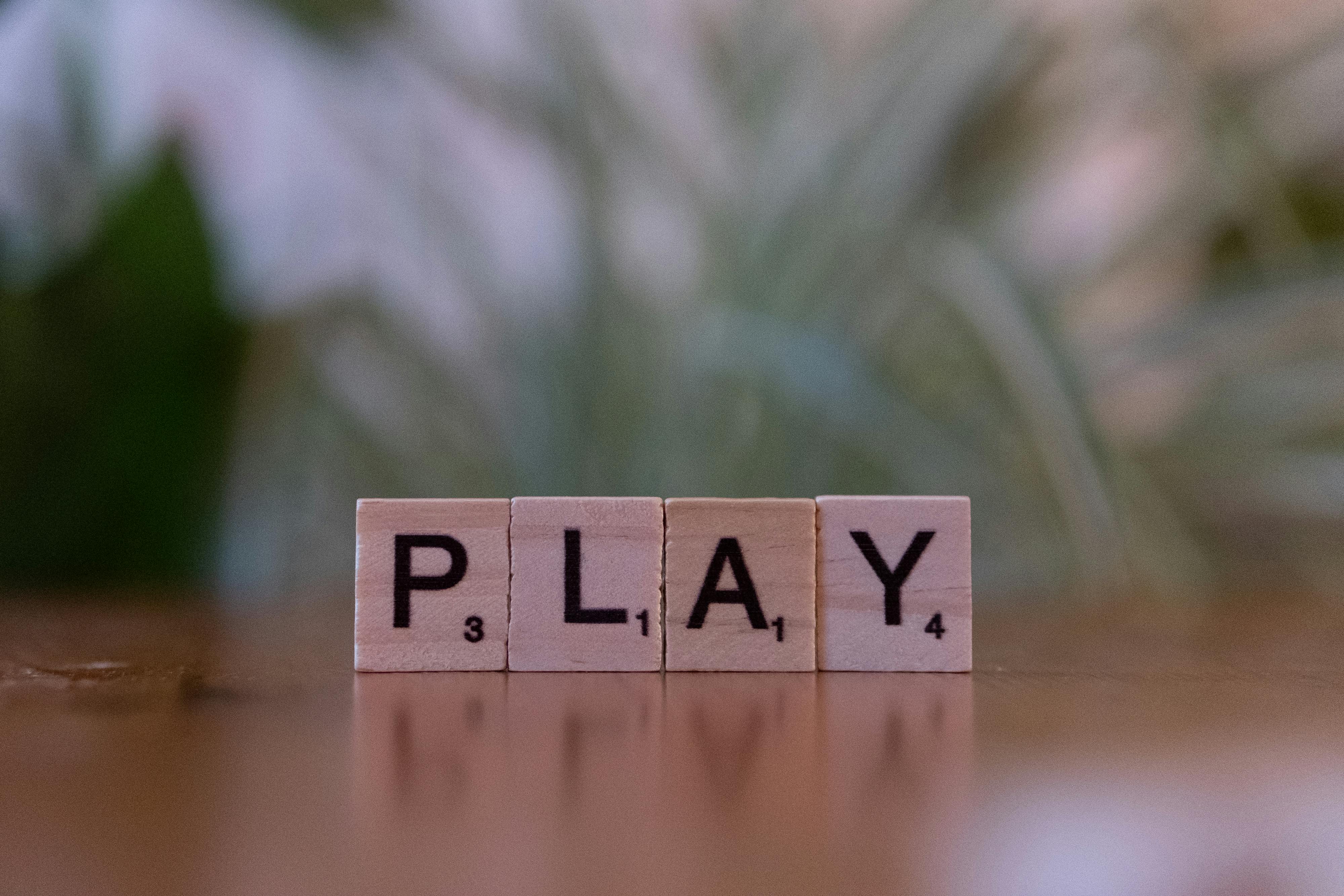 Wooden Scrabble Tiles Spelling 'PLAY' on Table · Free Stock Photo