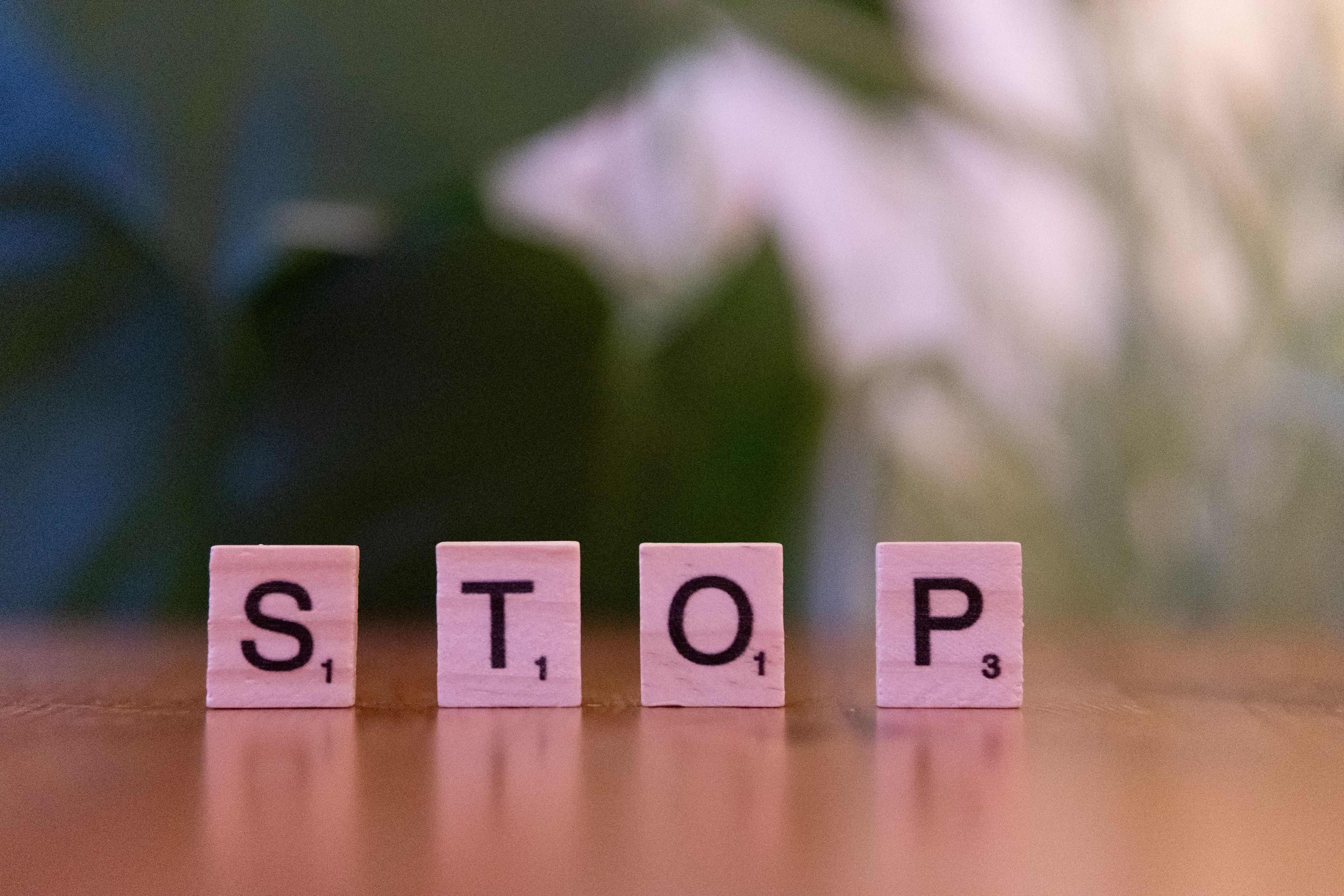 Scrabble Tiles Spelling STOP Close-up · Free Stock Photo