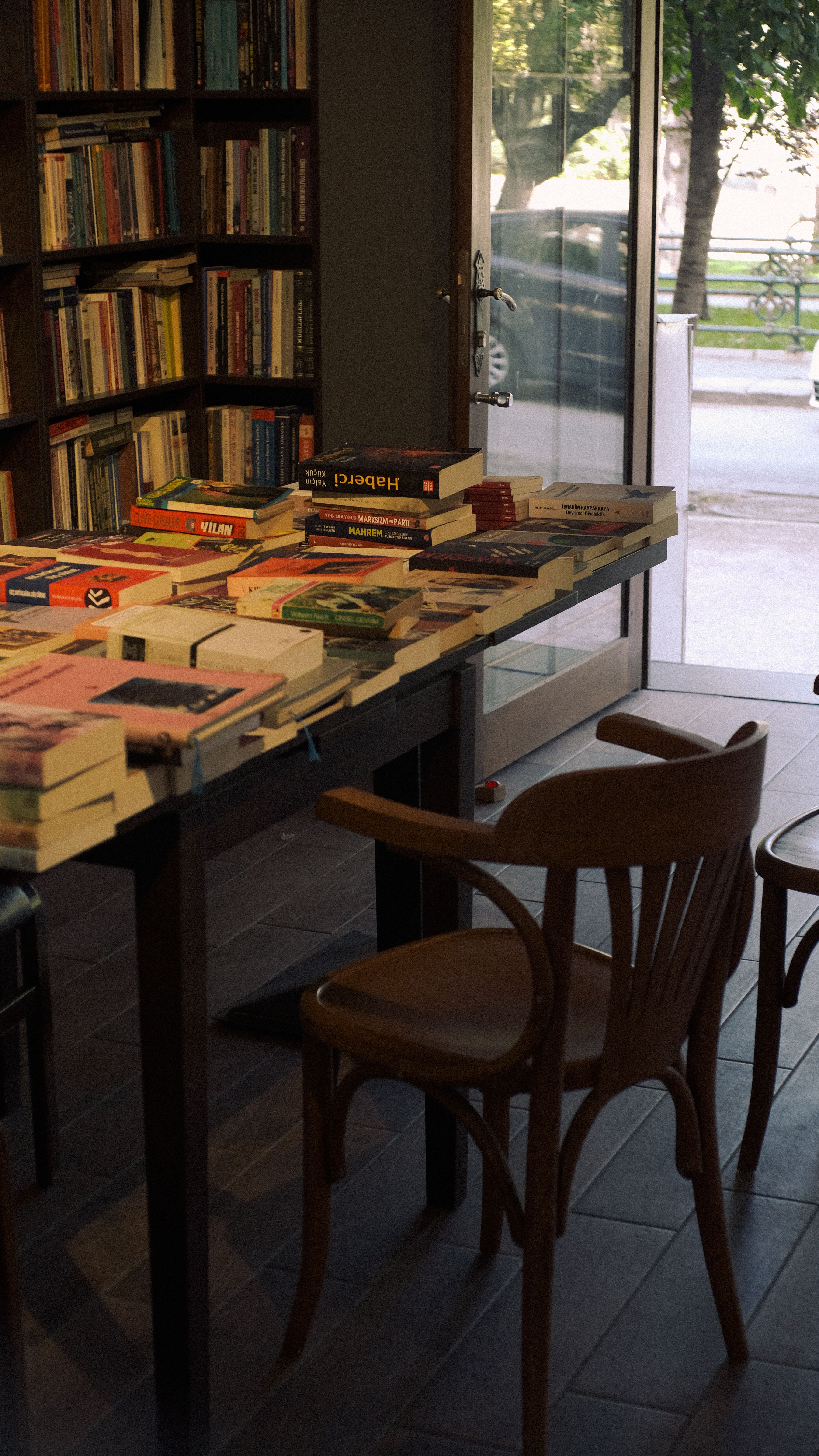 Cozy Bookstore Interior with Wooden Chairs · Free Stock Photo
