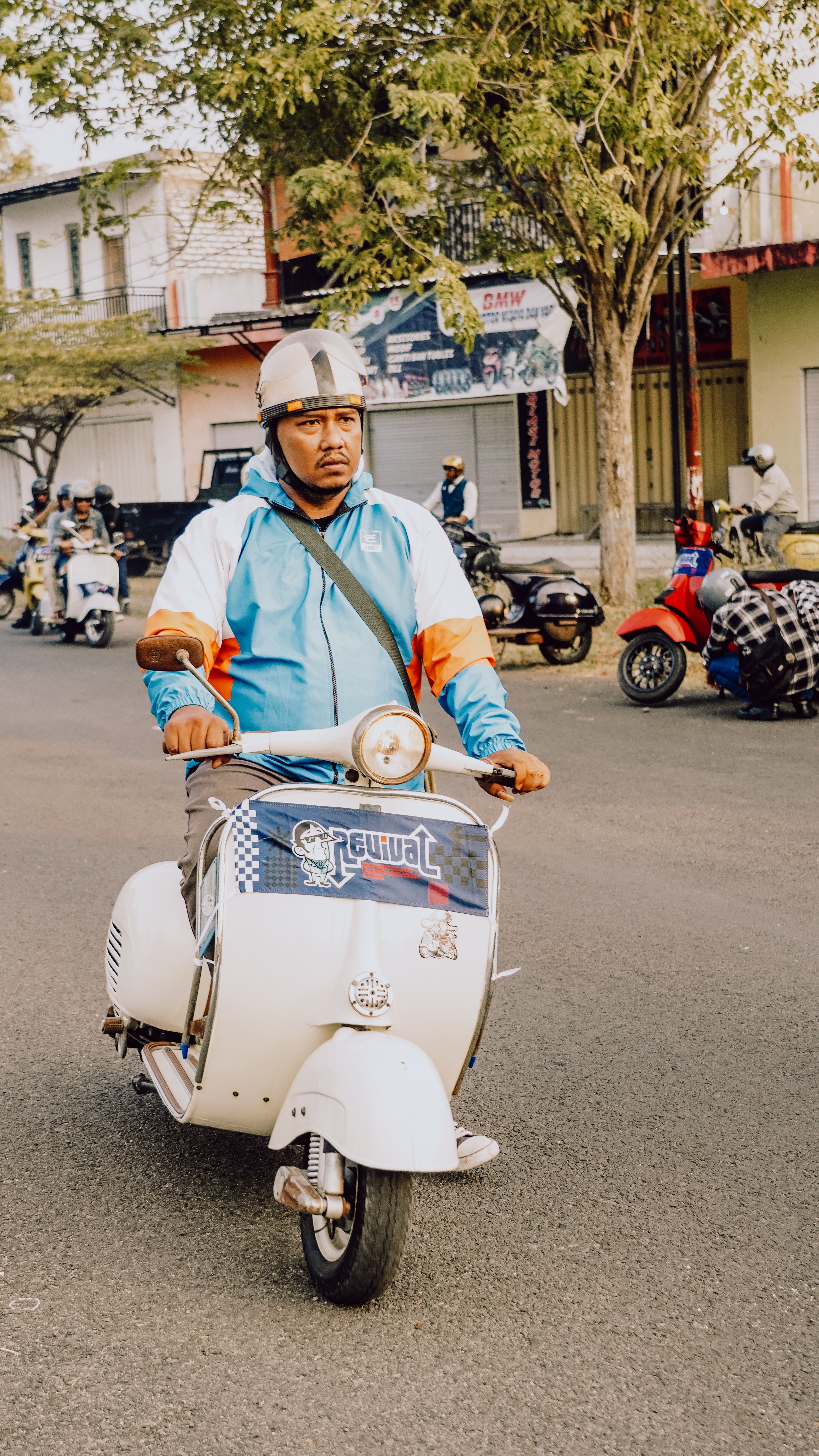 Man Riding Vintage Vespa in East Java Street · Free Stock Photo
