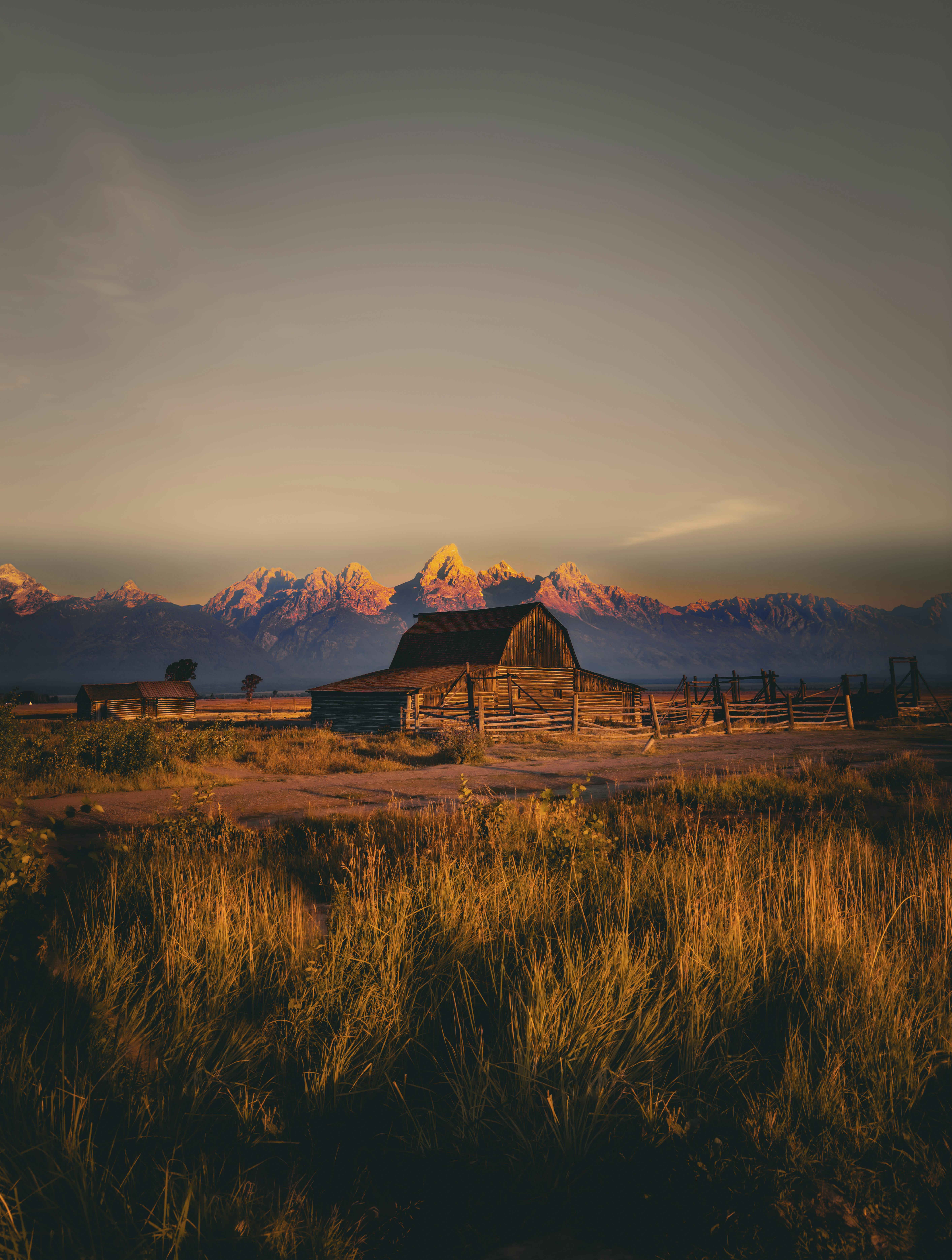Rustic Barn in Wyoming with Mountain Backdrop · Free Stock Photo