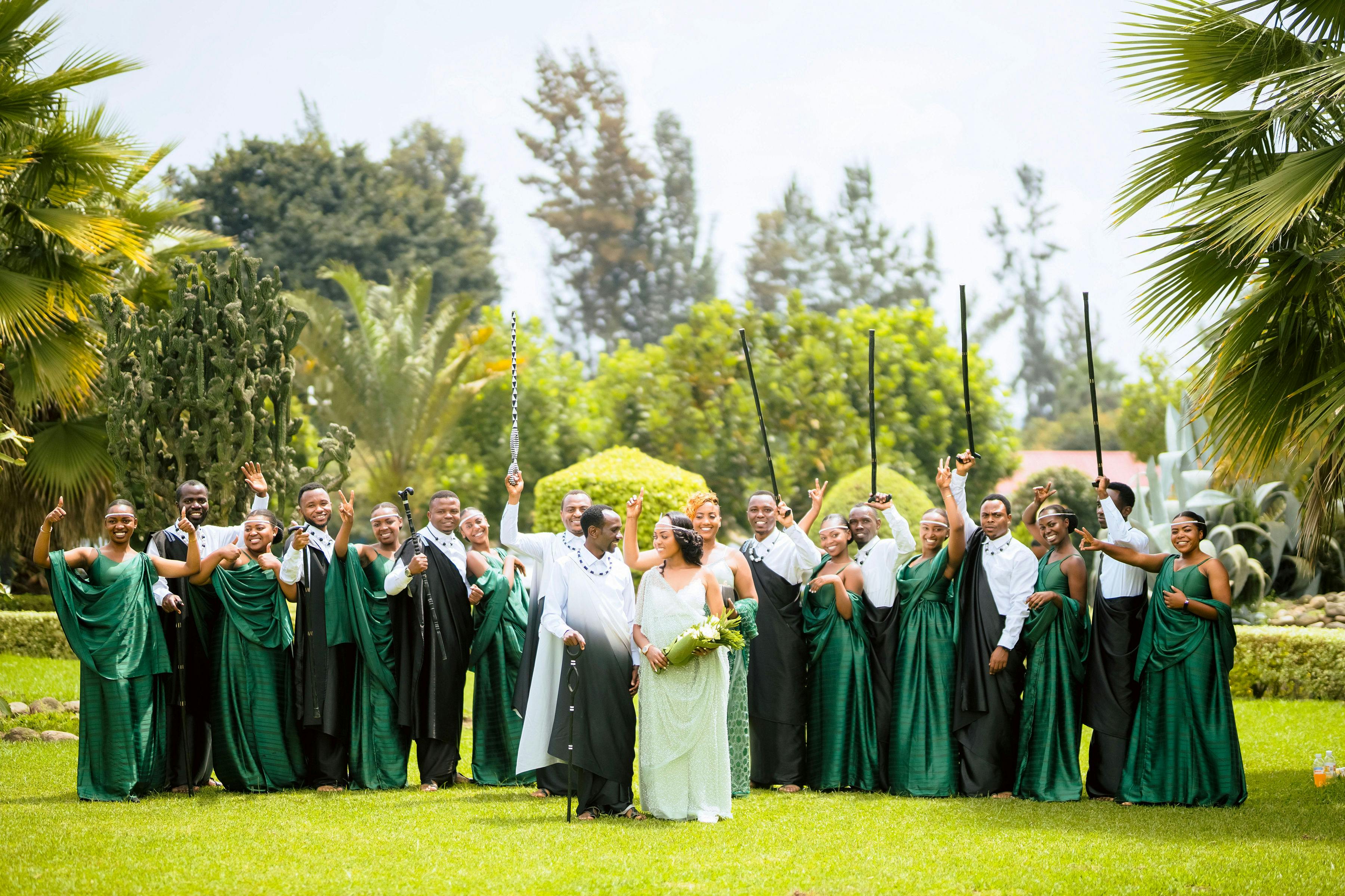 Joyful Green-Clad Wedding Party Outdoors · Free Stock Photo