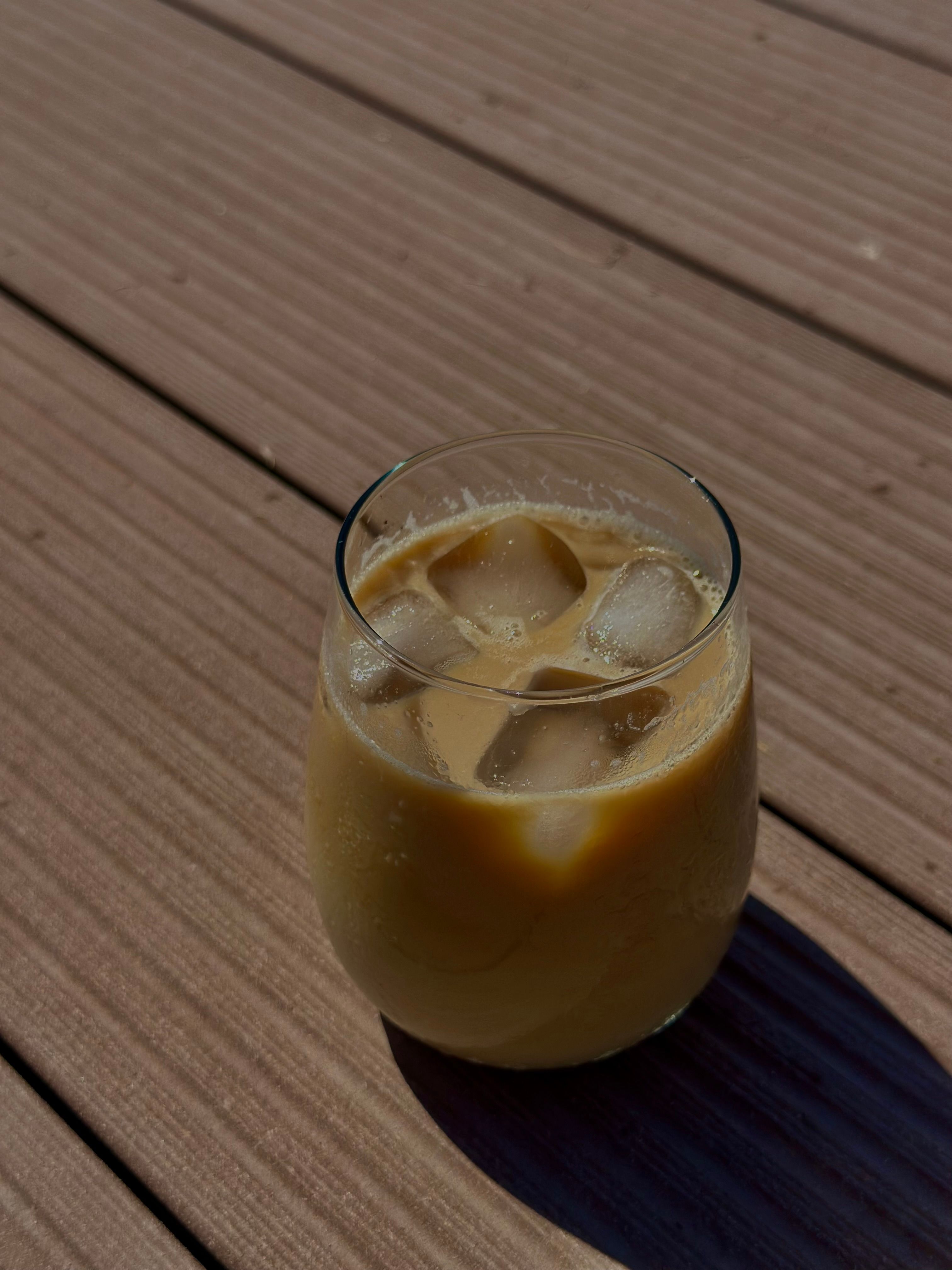 Iced Coffee on Wooden Deck in Summer Sunlight · Free Stock Photo