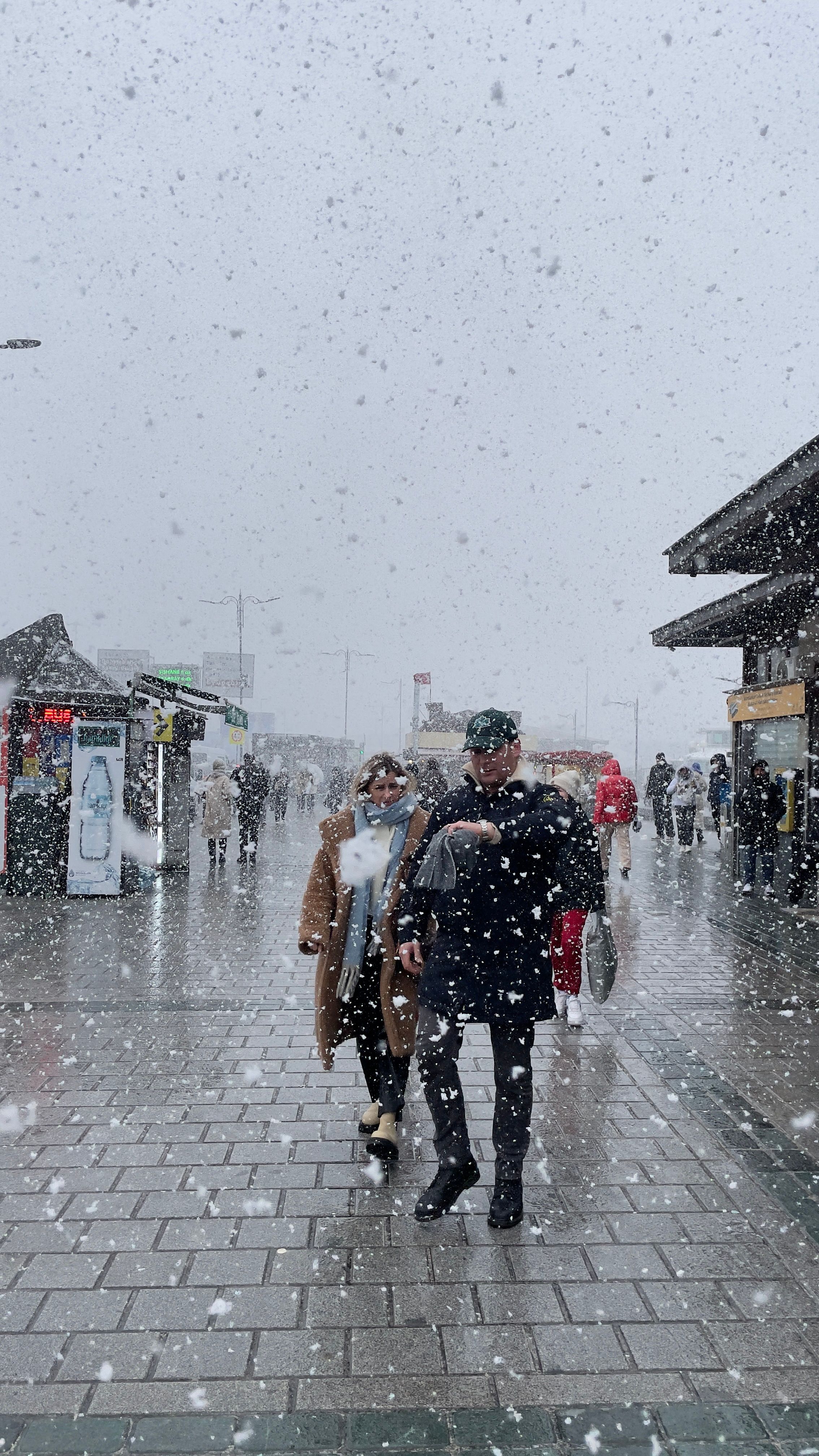 Winter Snowfall in Busy City Street Scene · Free Stock Photo