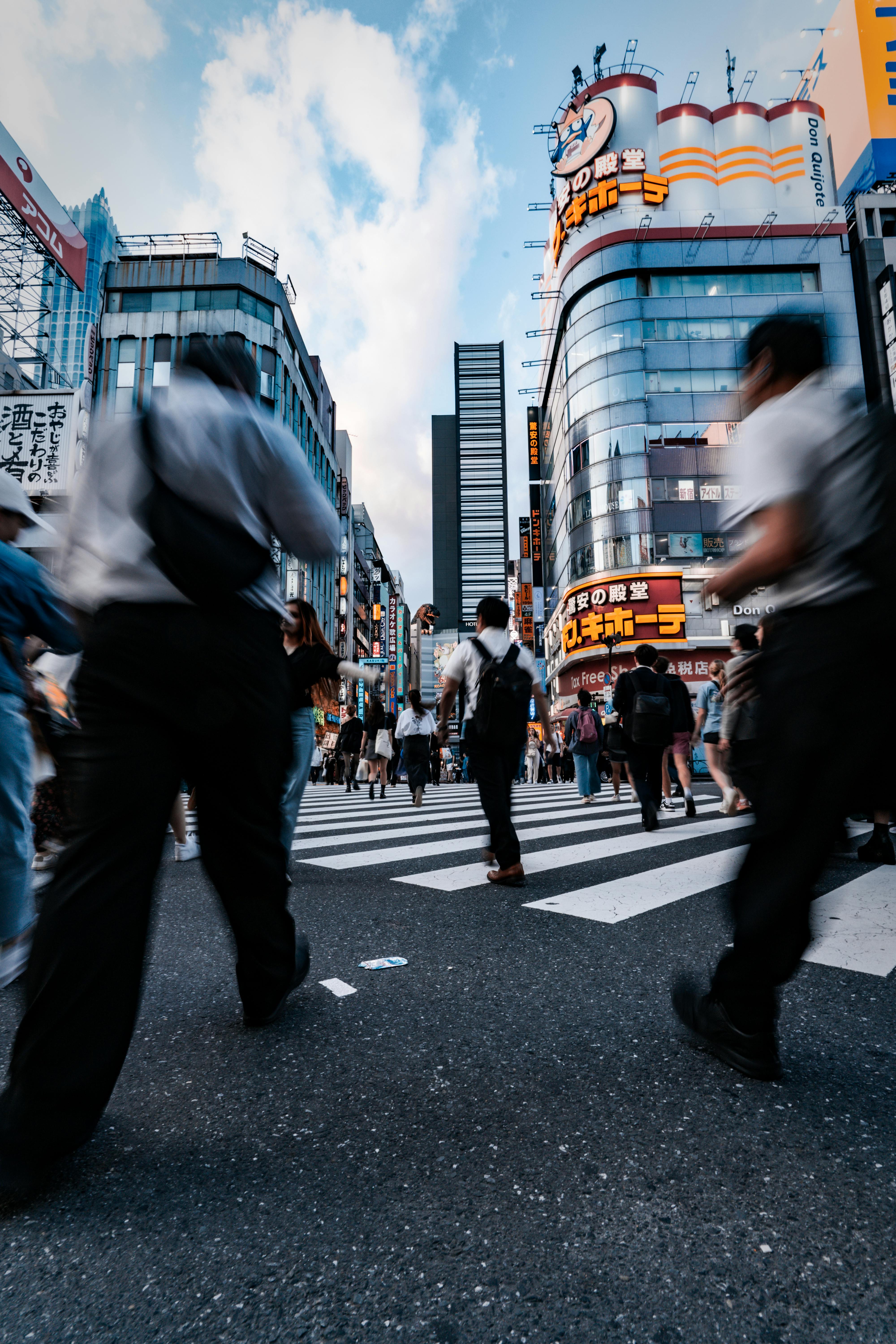 Bustling Tokyo Street Crosswalk at Dusk · Free Stock Photo