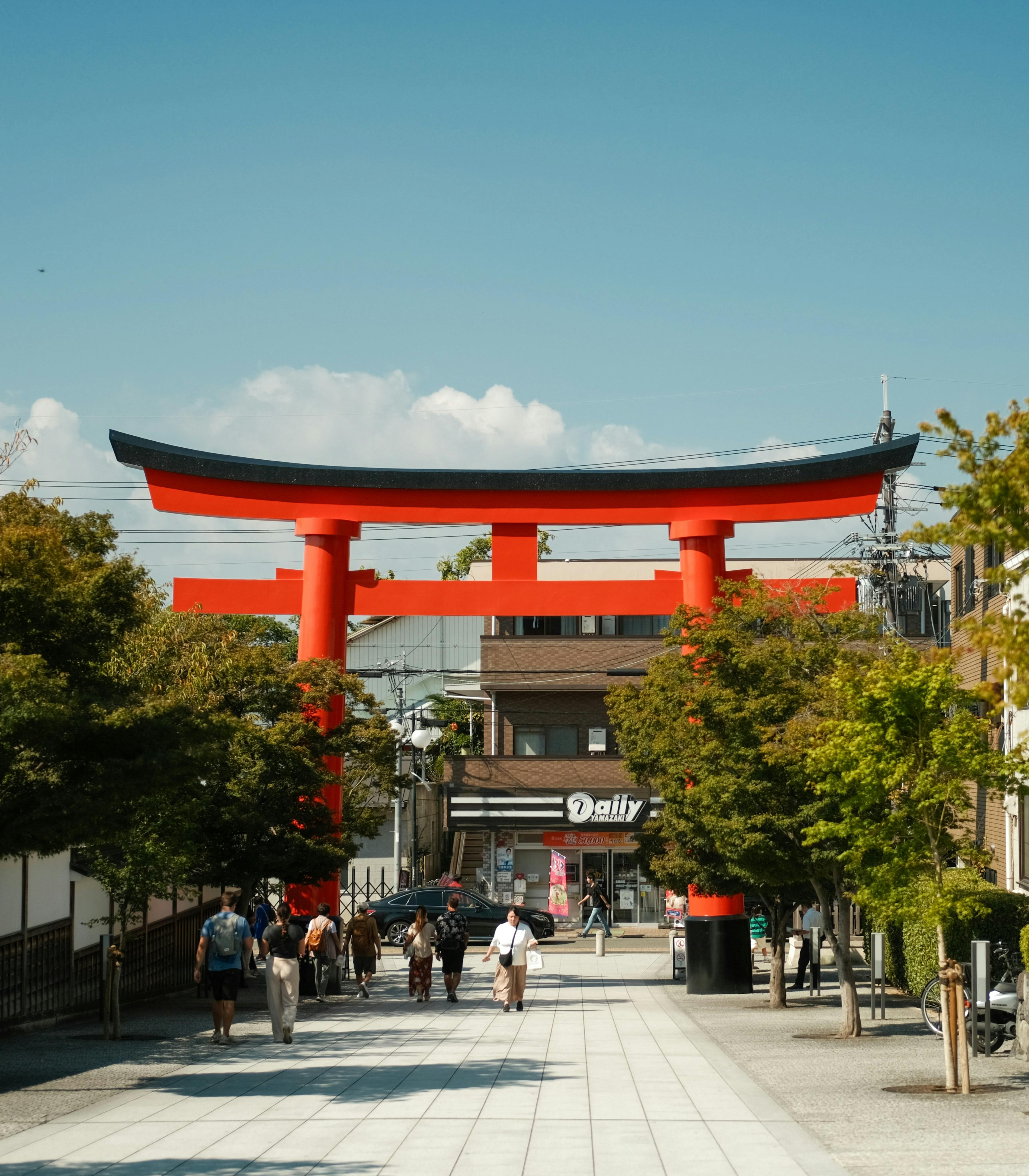 Red Torii Gate and People on Street · Free Stock Photo