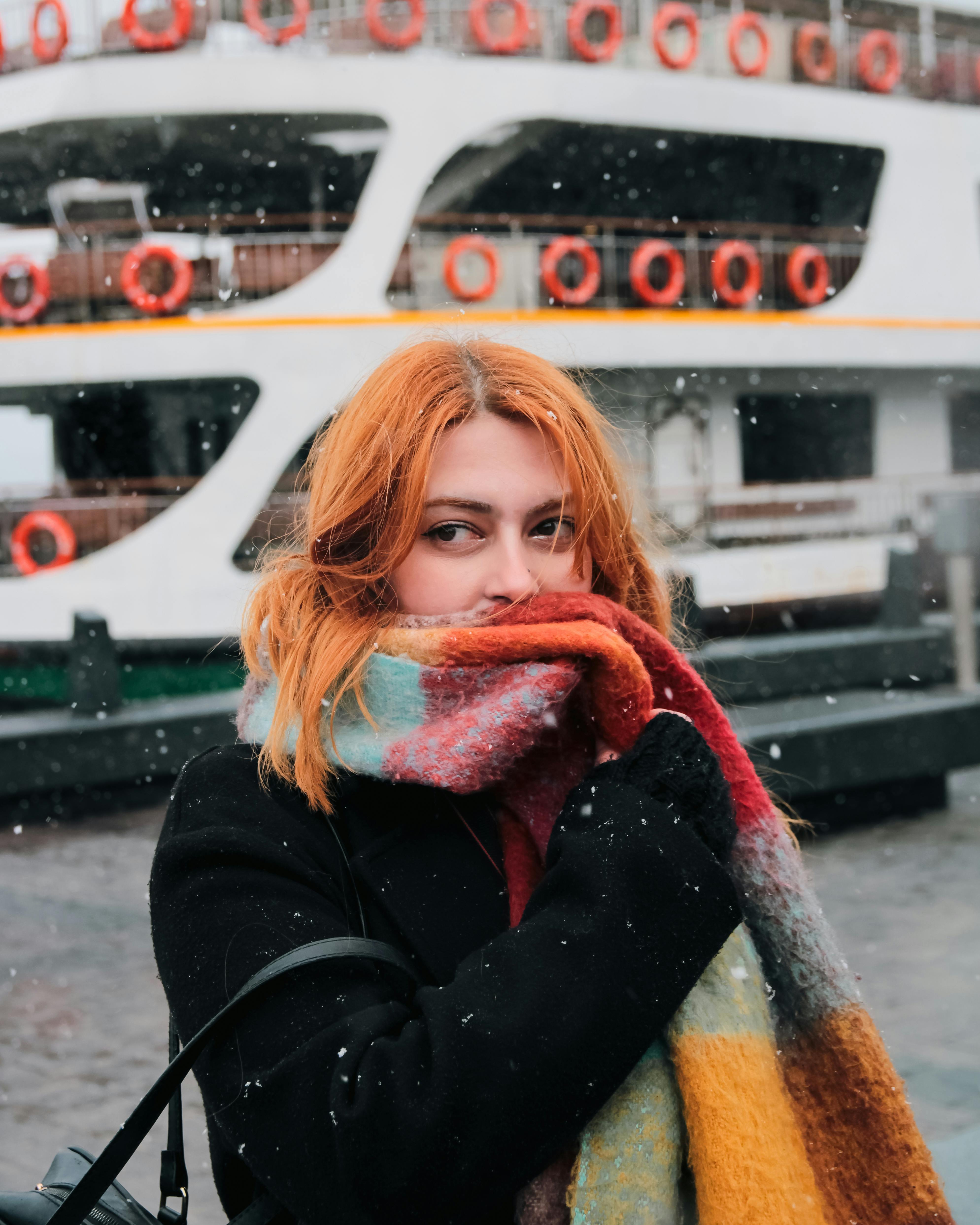Woman in Winter Clothing by a Ferry · Free Stock Photo