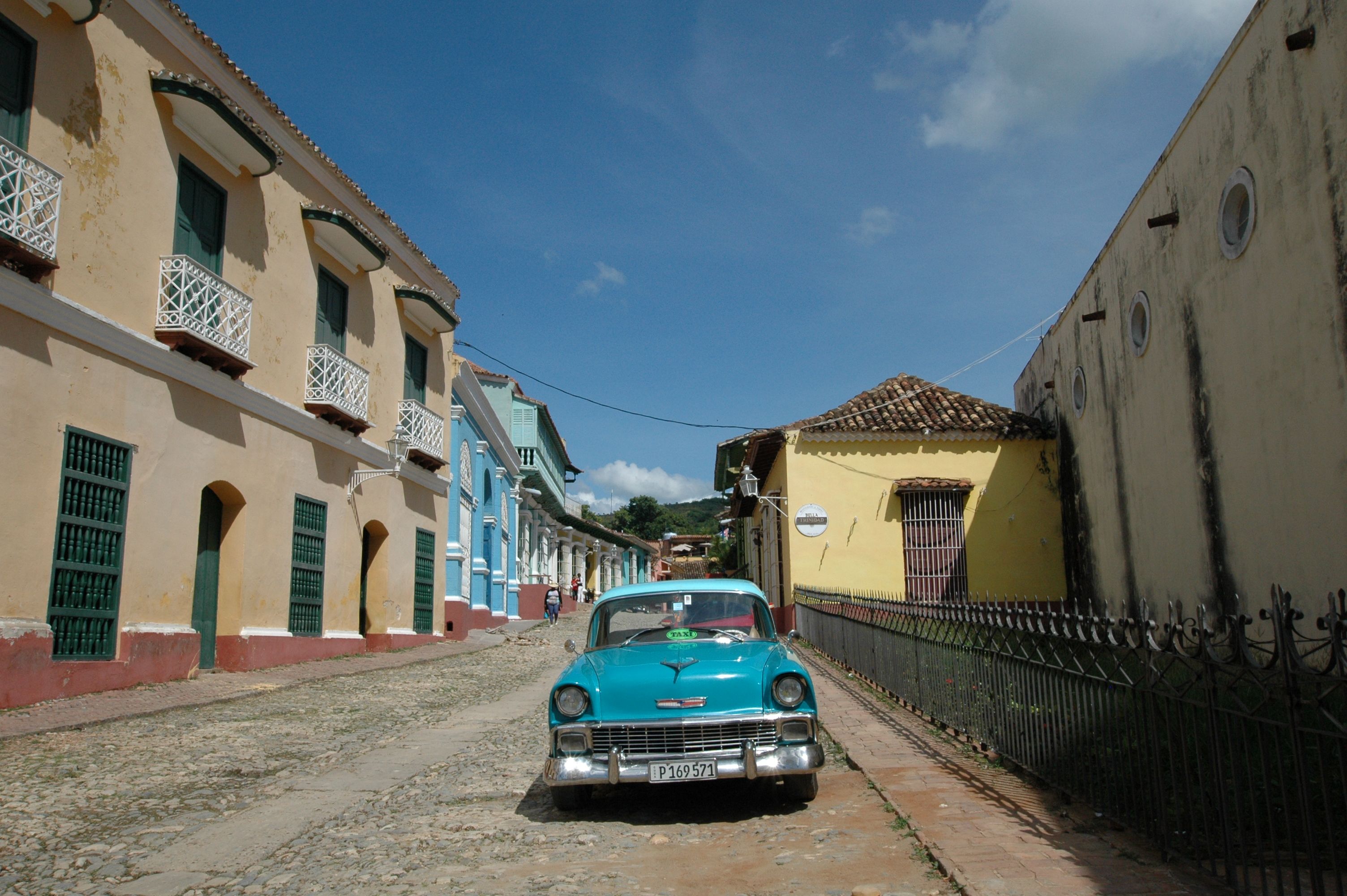 Classic Car on a Colorful Cuban Street · Free Stock Photo