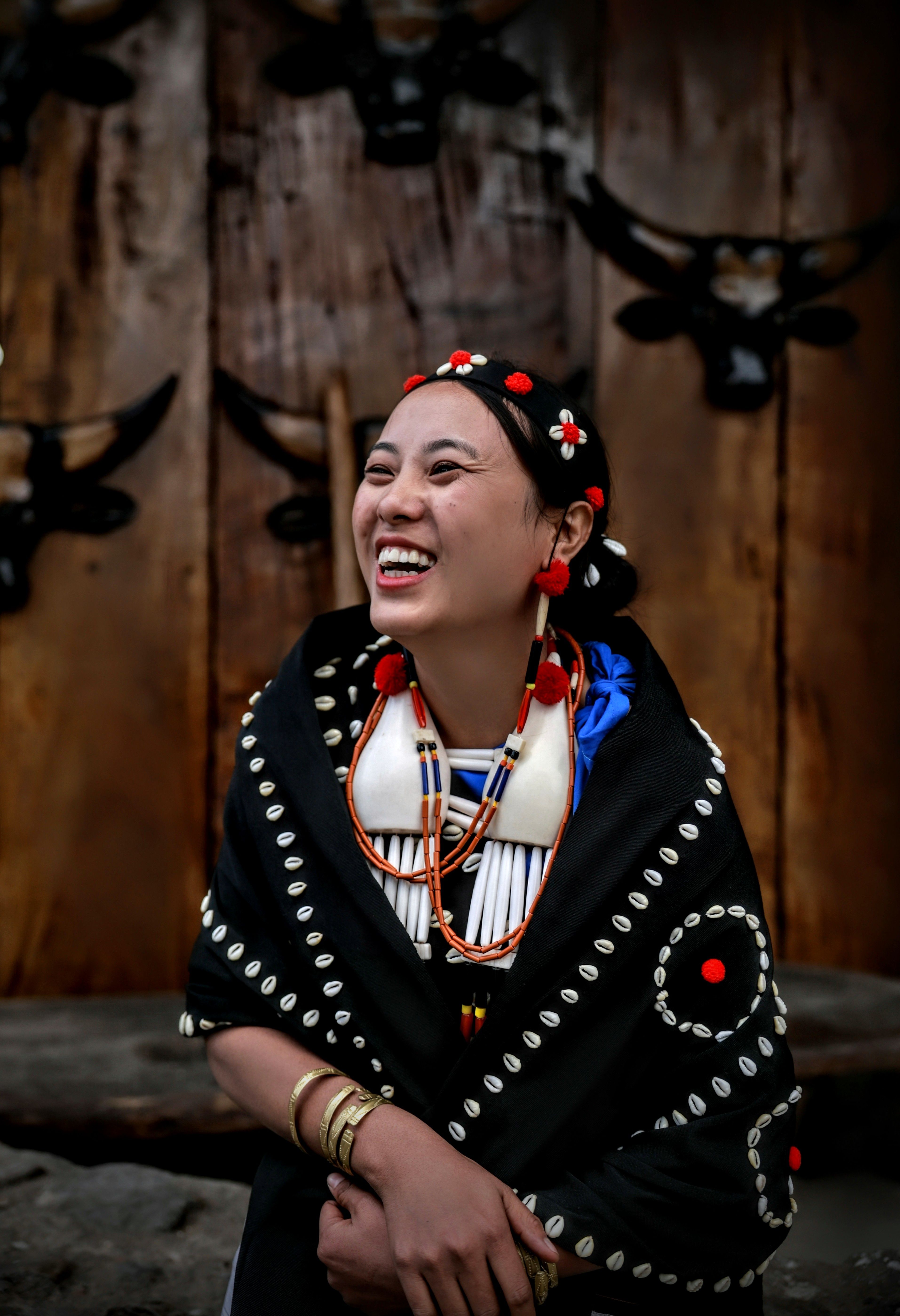 Smiling Woman in Traditional Naga Attire · Free Stock Photo