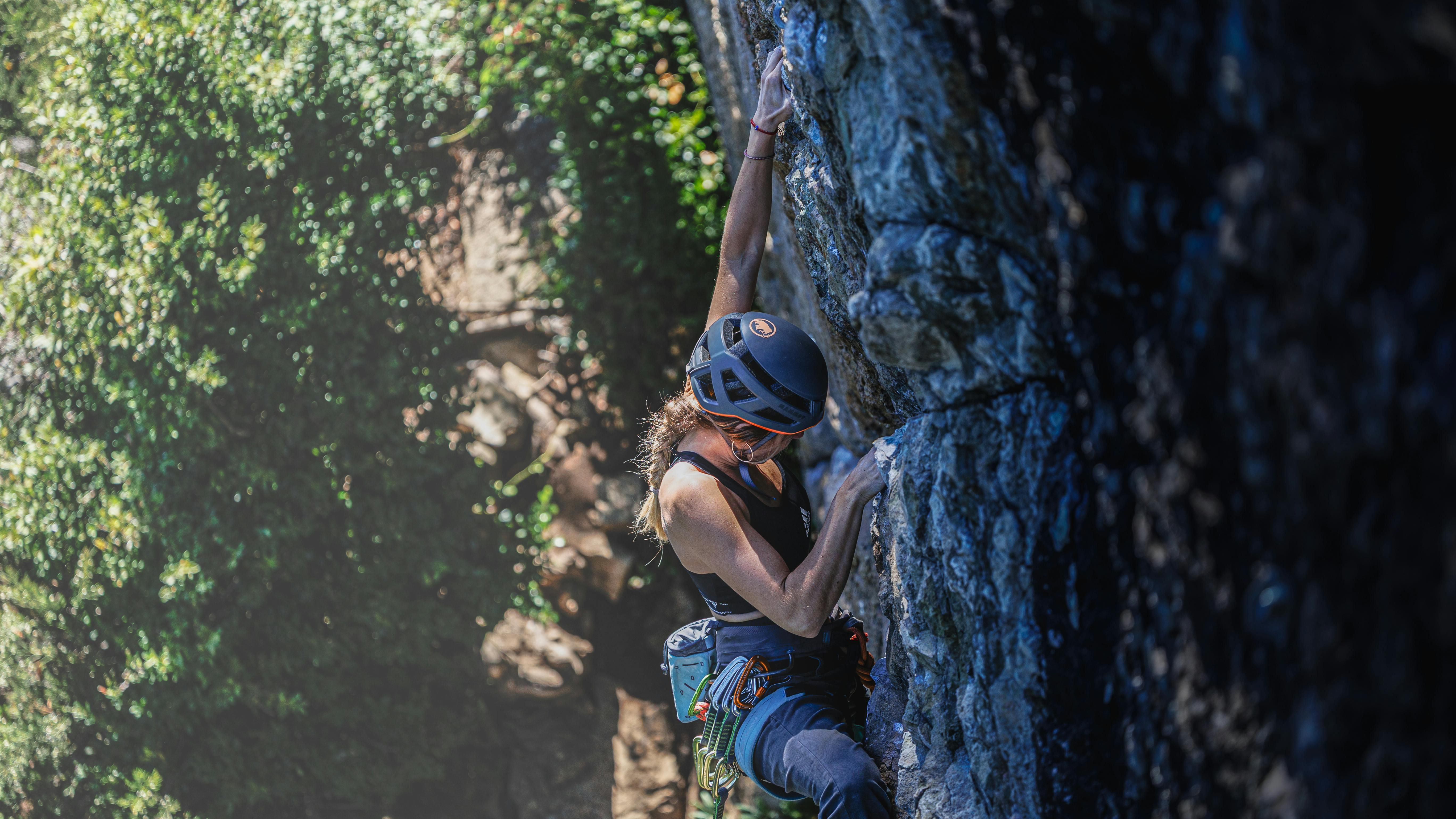 Woman Rock Climbing on Rugged Outdoor Cliff · Free Stock Photo