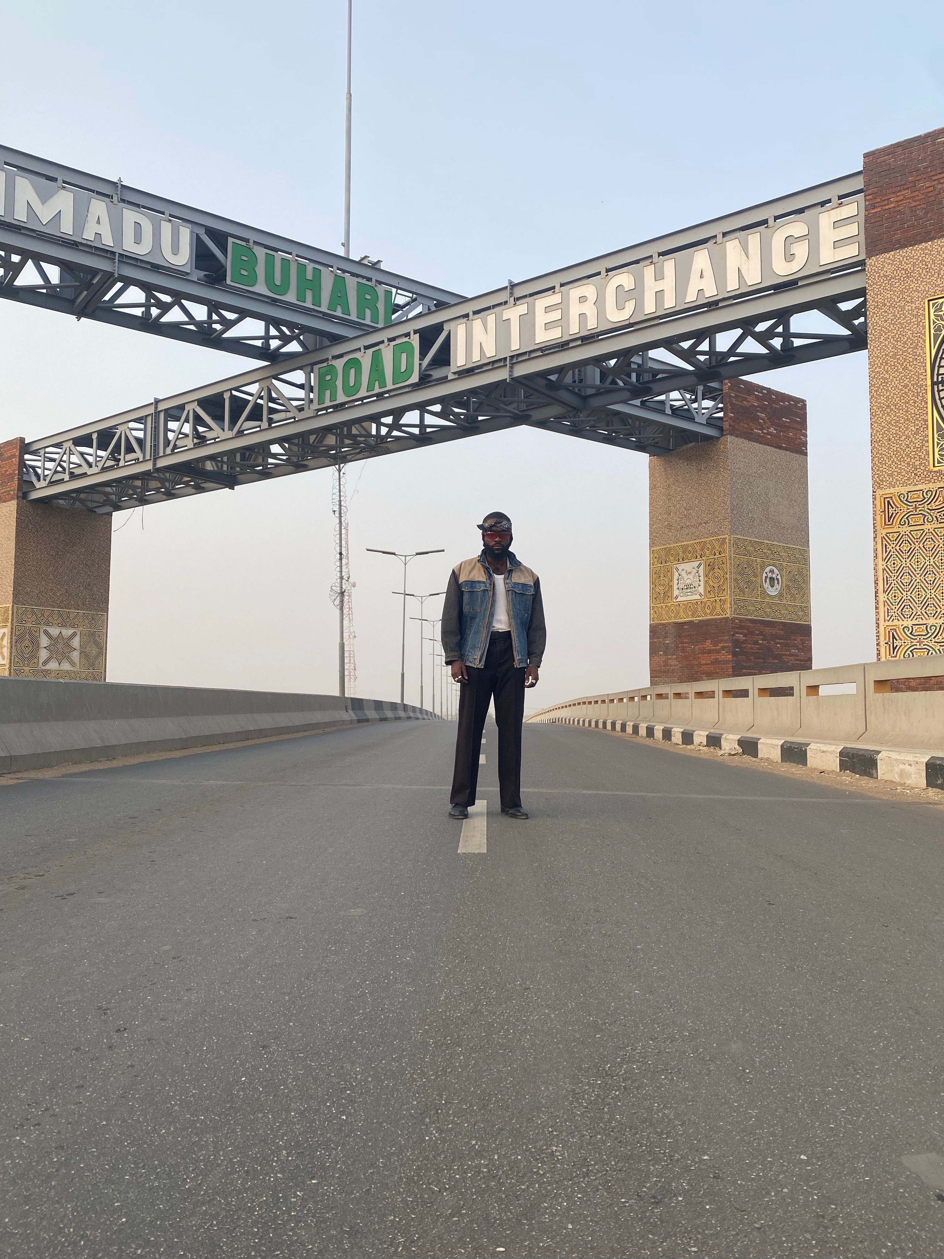 Man Standing on Buhari Road Interchange Bridge · Free Stock Photo