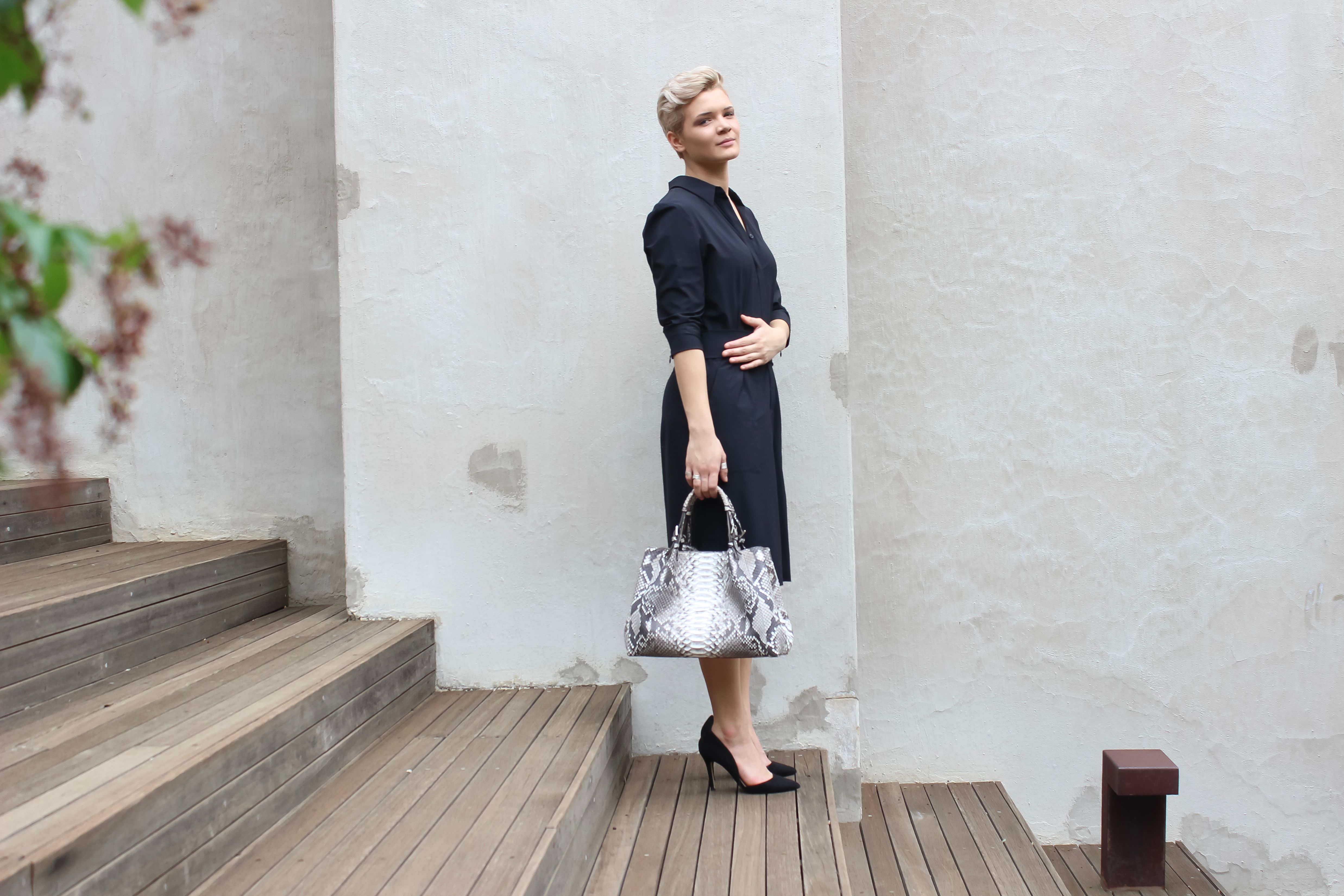 Stylish Woman Holding Designer Handbag Outdoors · Free Stock Photo