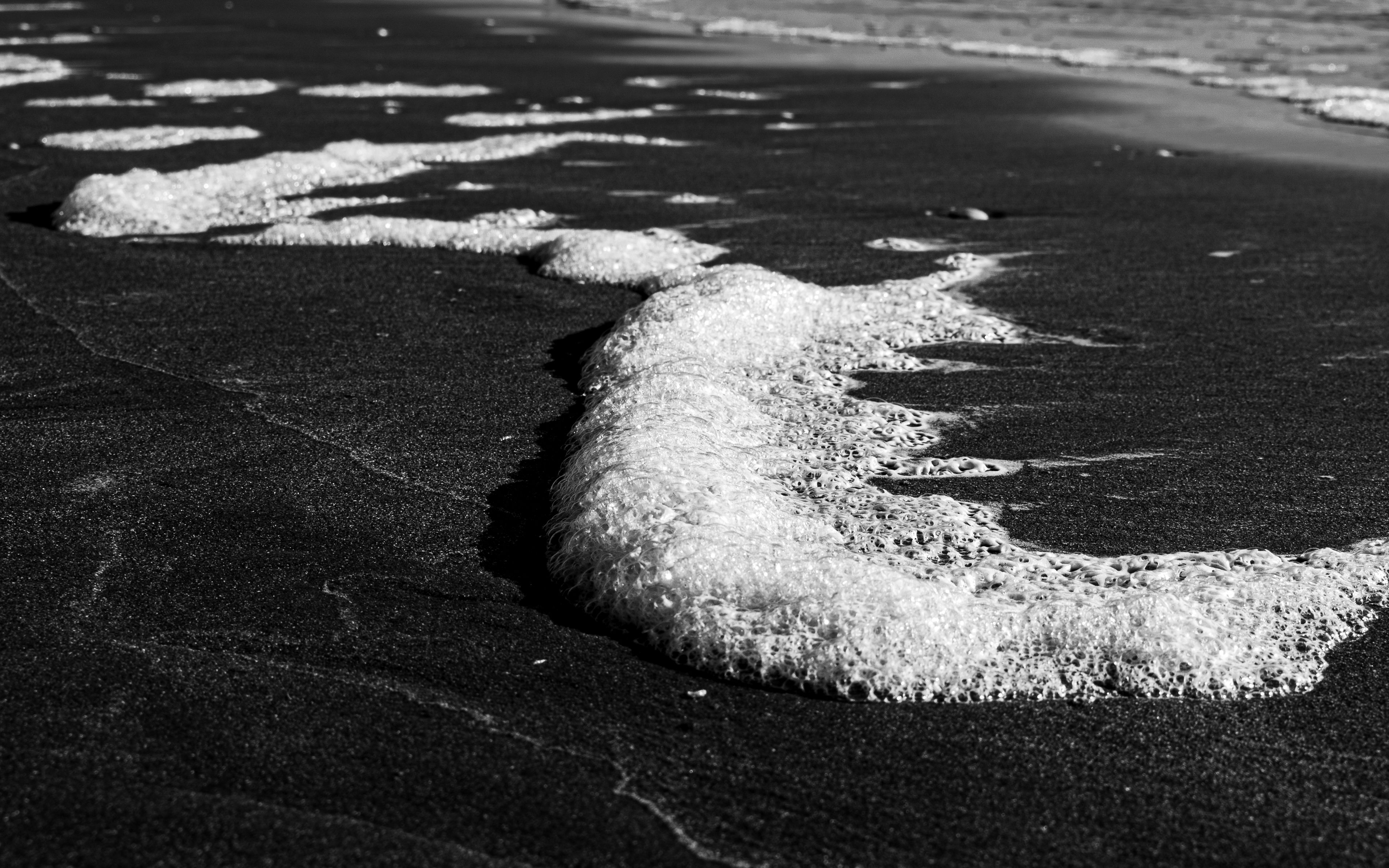 Monochrome Beach Foam at La Lucila del Mar · Free Stock Photo