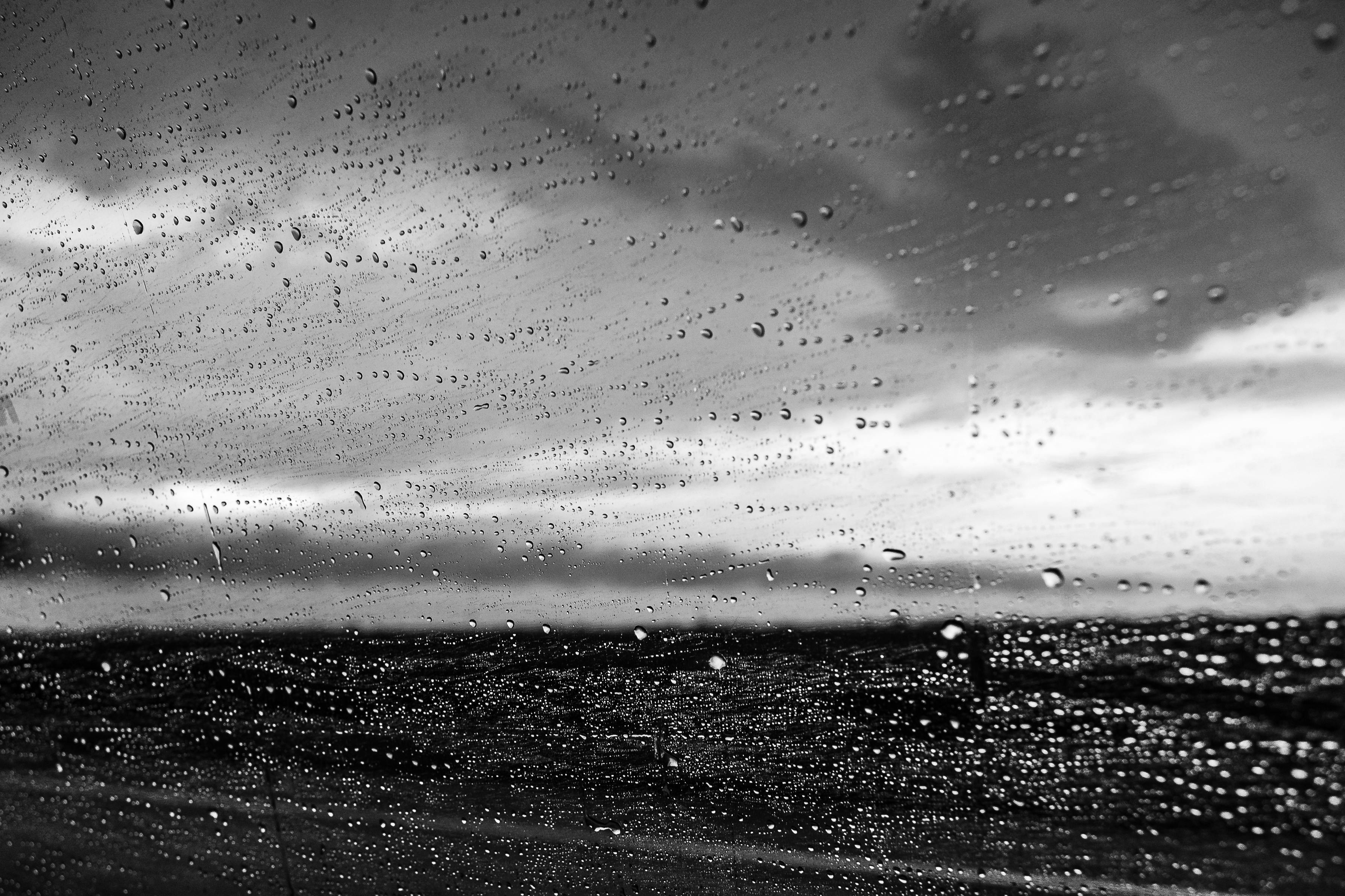 Dramatic Rainy Ocean View Through Window · Free Stock Photo