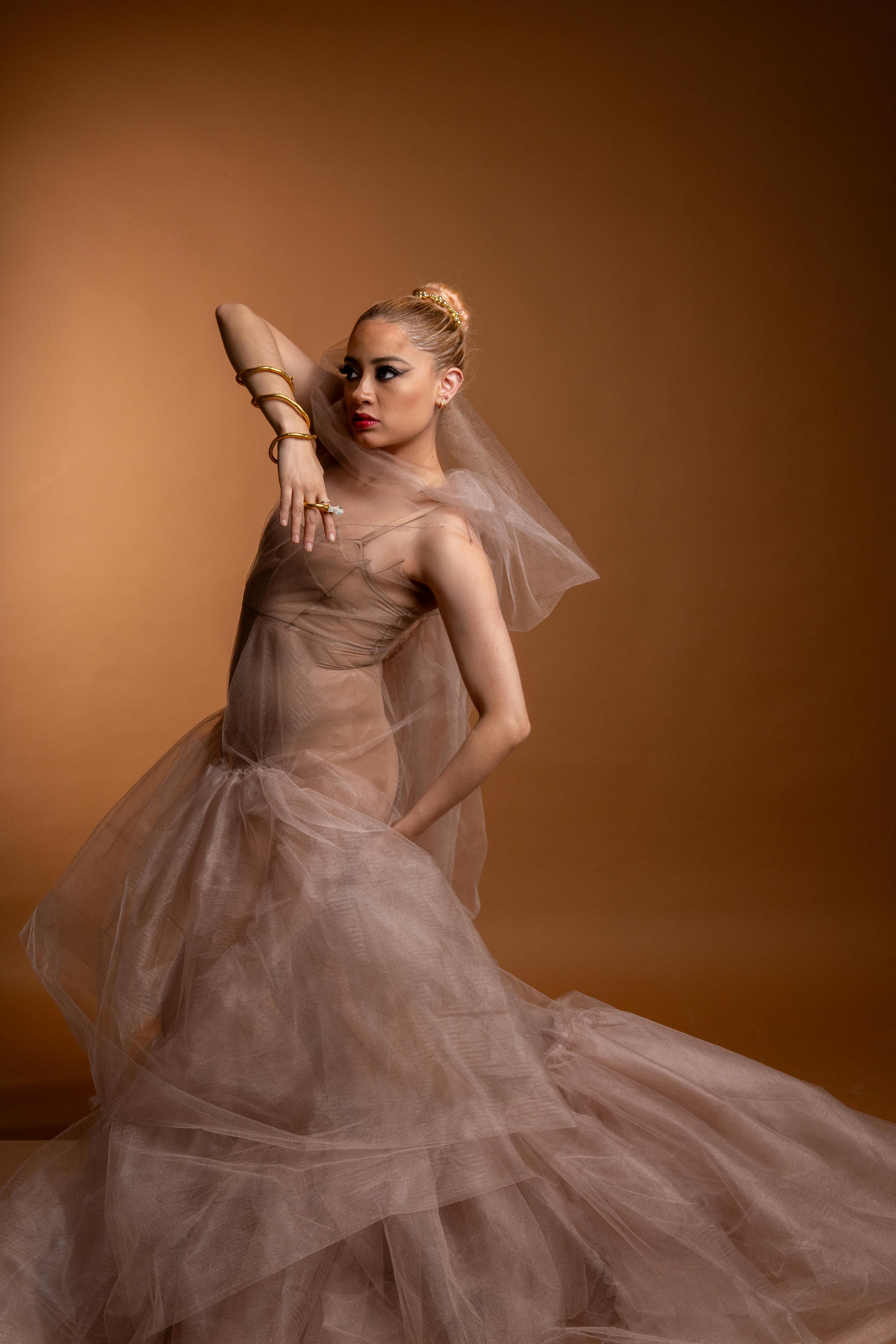 Elegant Ballet Dancer in Mocha Dress Pose · Free Stock Photo