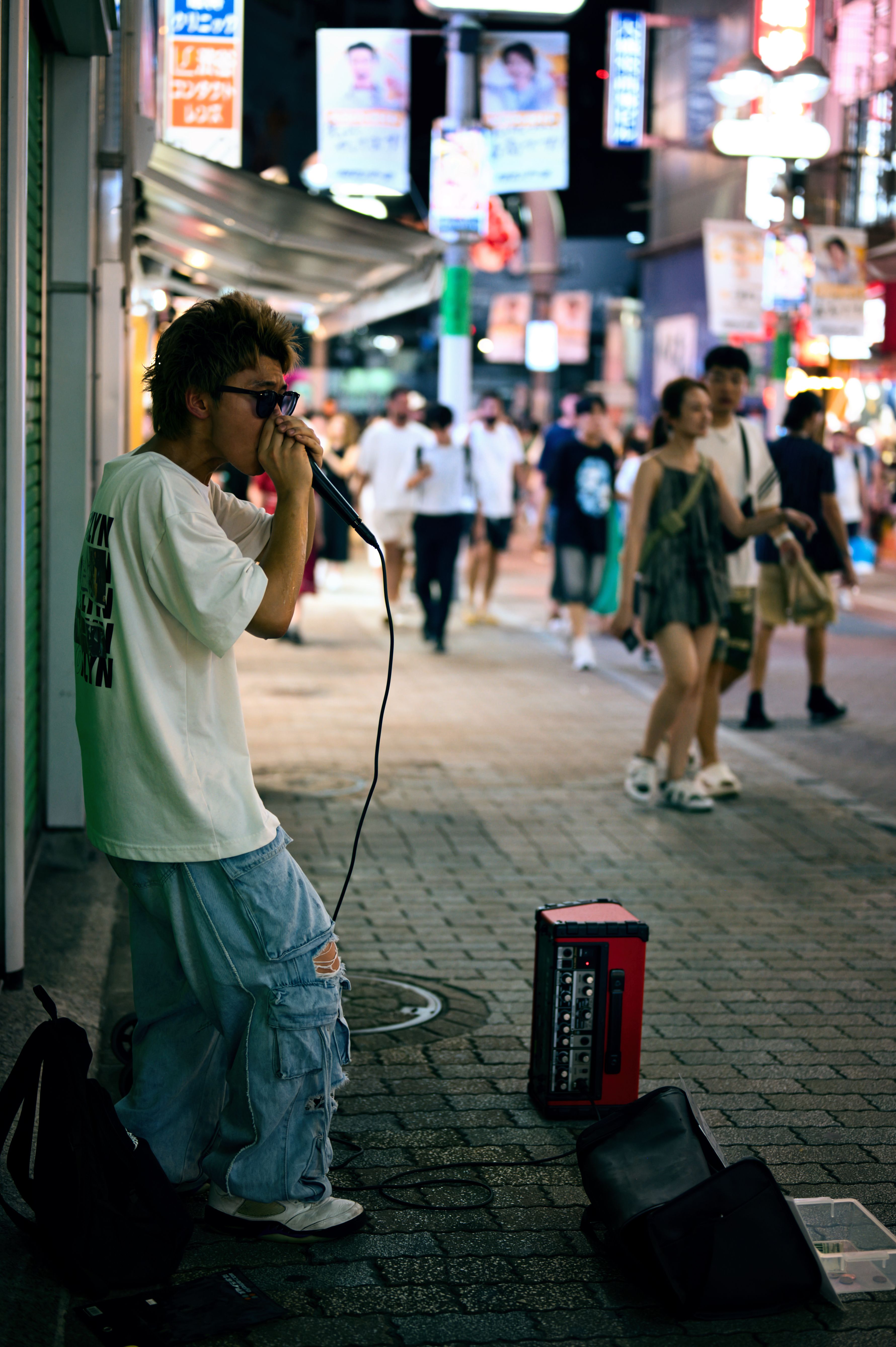 Street Performer Singing at Night in Tokyo · Free Stock Photo