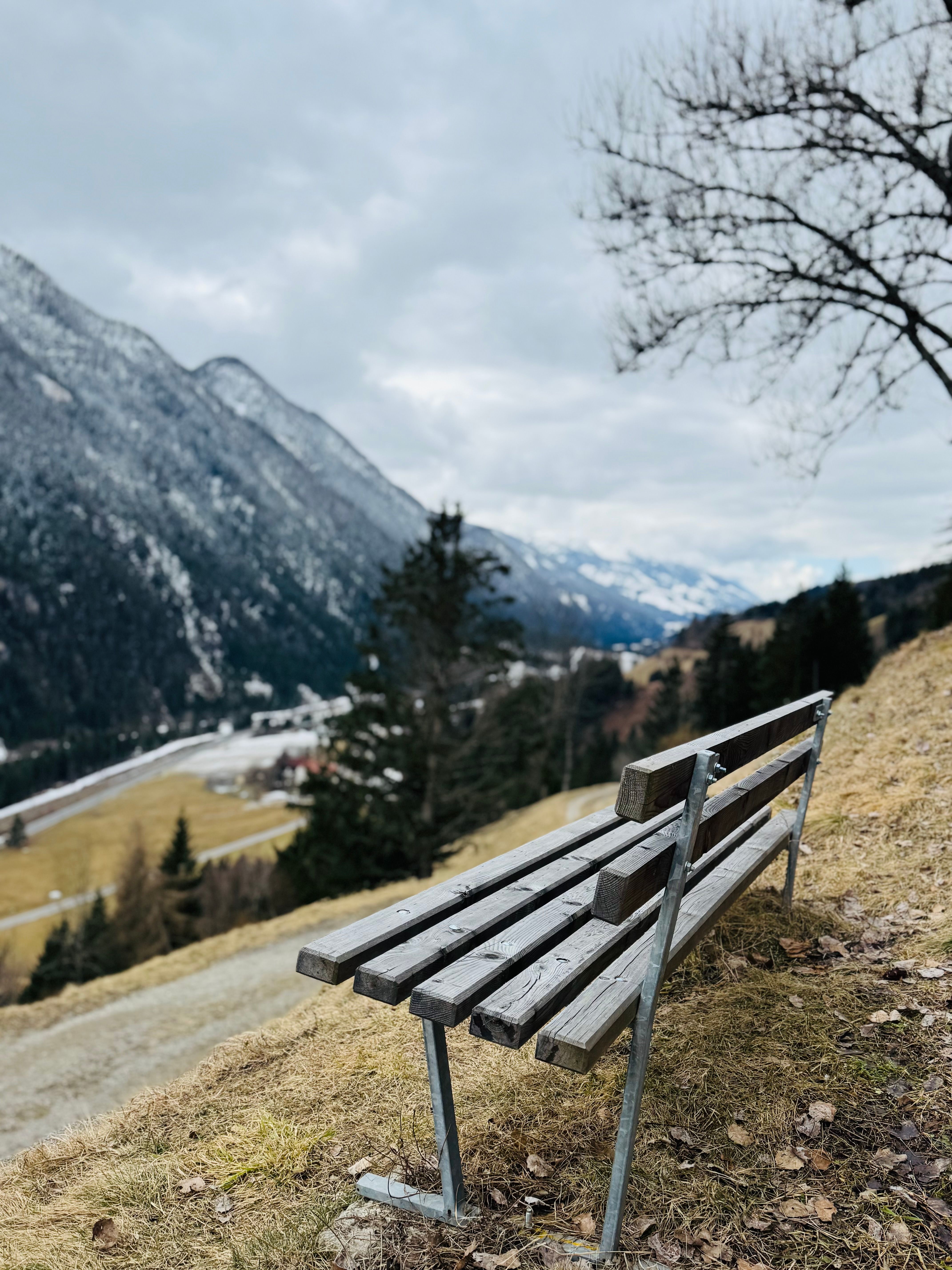 Serene Mountain View with Wooden Bench · Free Stock Photo