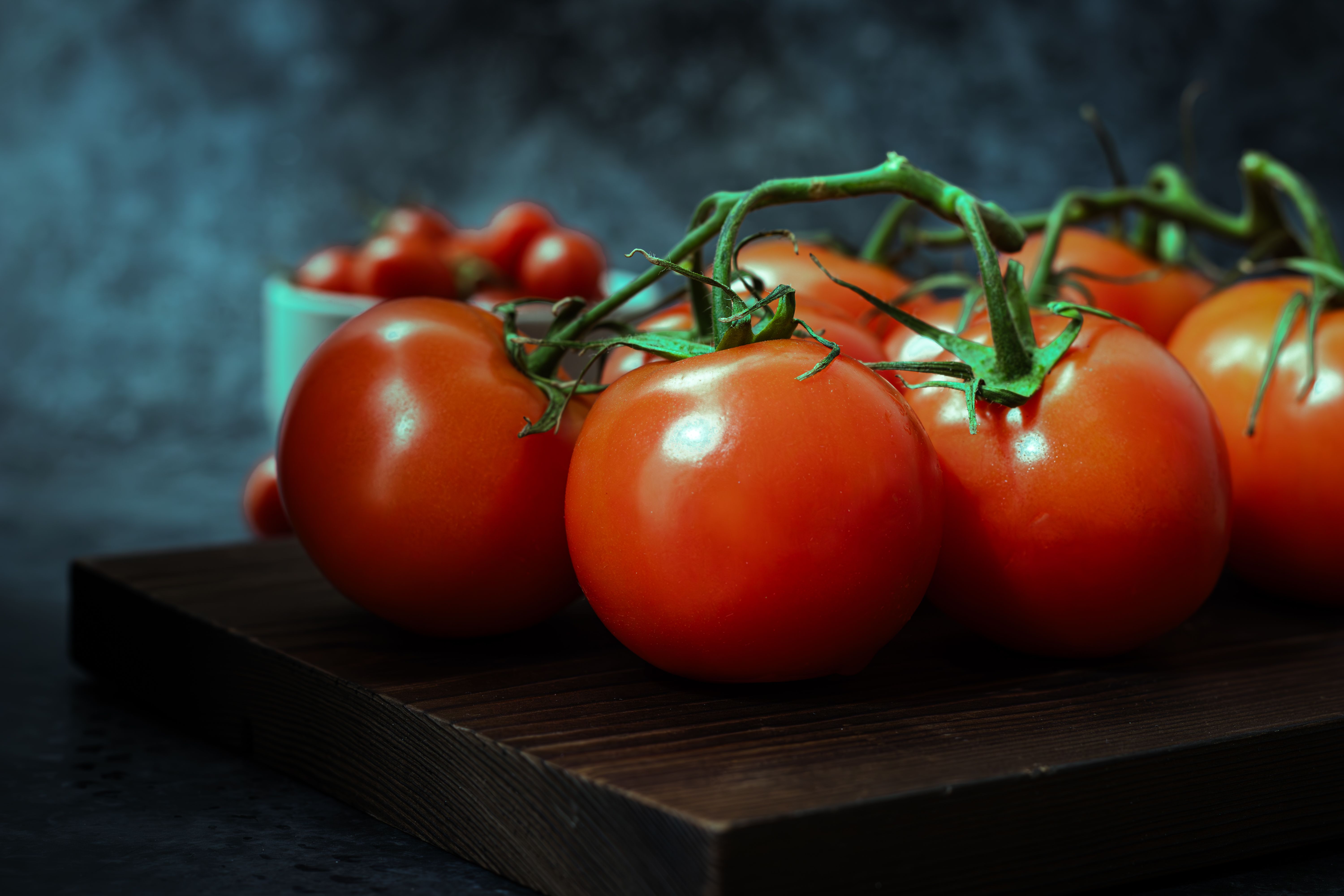 Dark Aesthetic Fresh Tomatoes on Wooden Board · Free Stock Photo