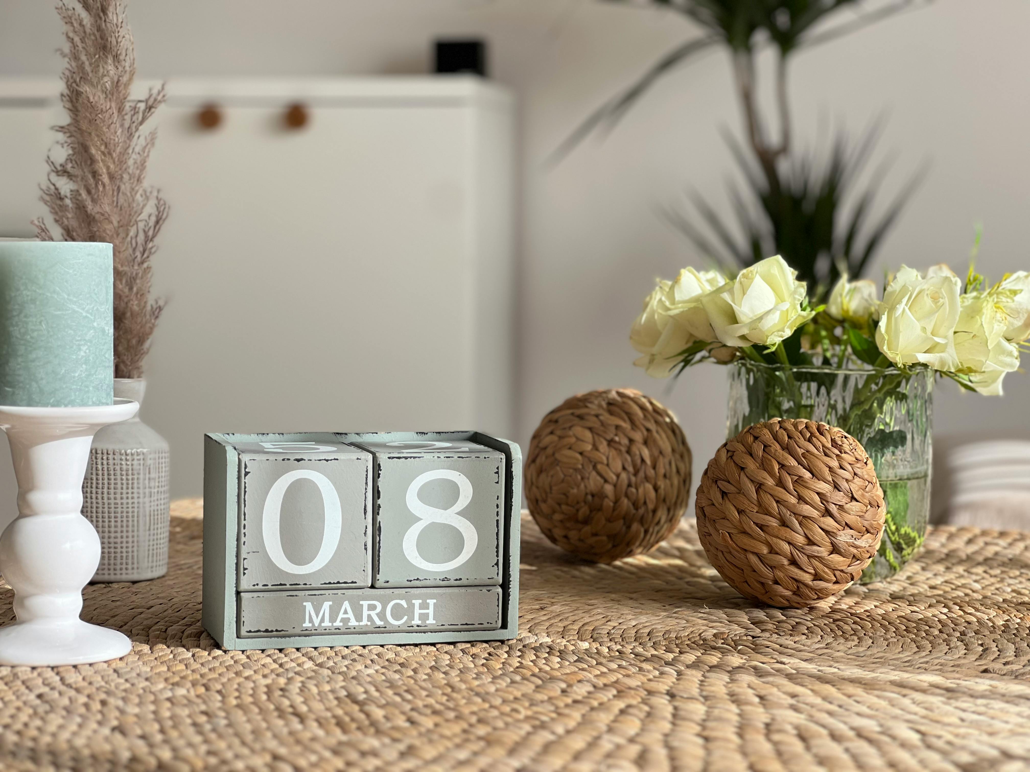 March 8th Decor with Flowers and Candle · Free Stock Photo