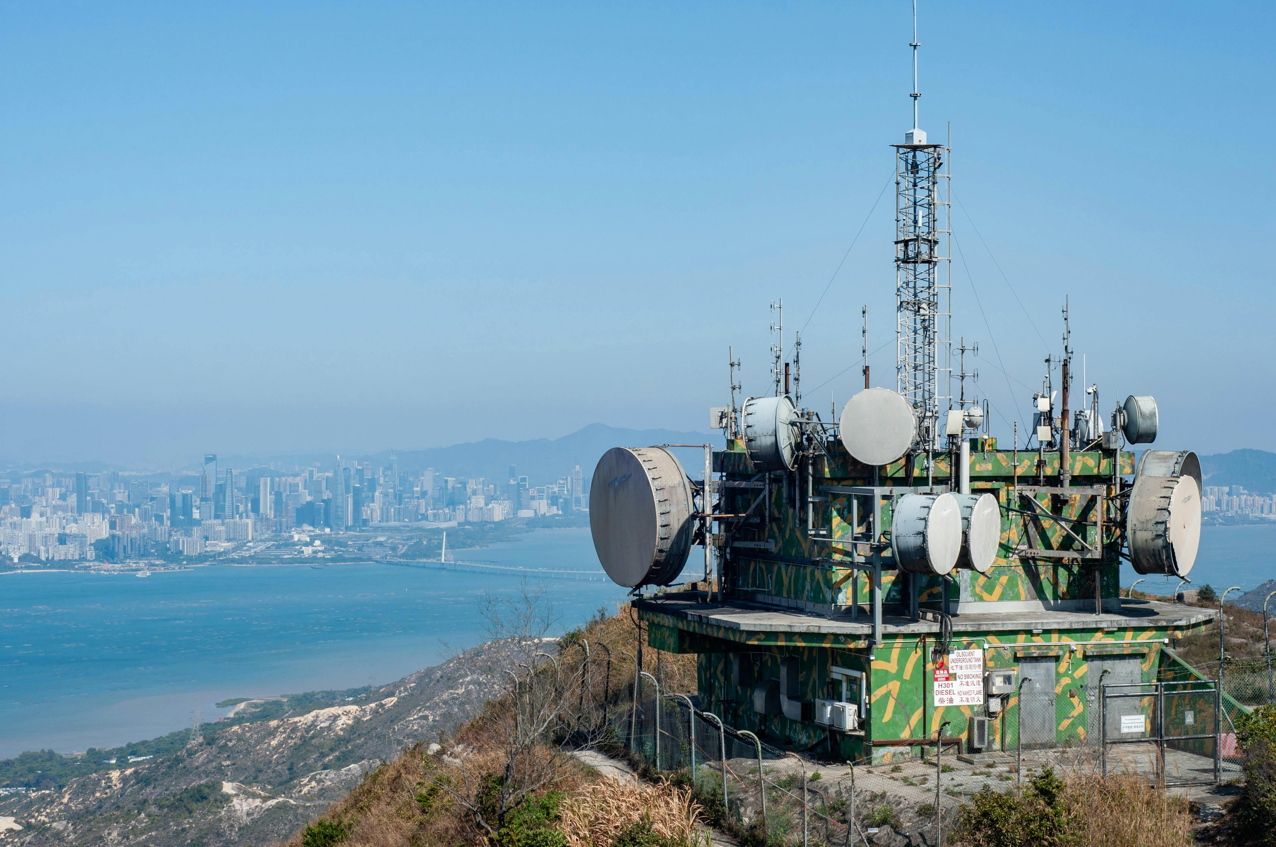 Telecommunications Tower in Hong Kong with Cityscape · Free Stock Photo