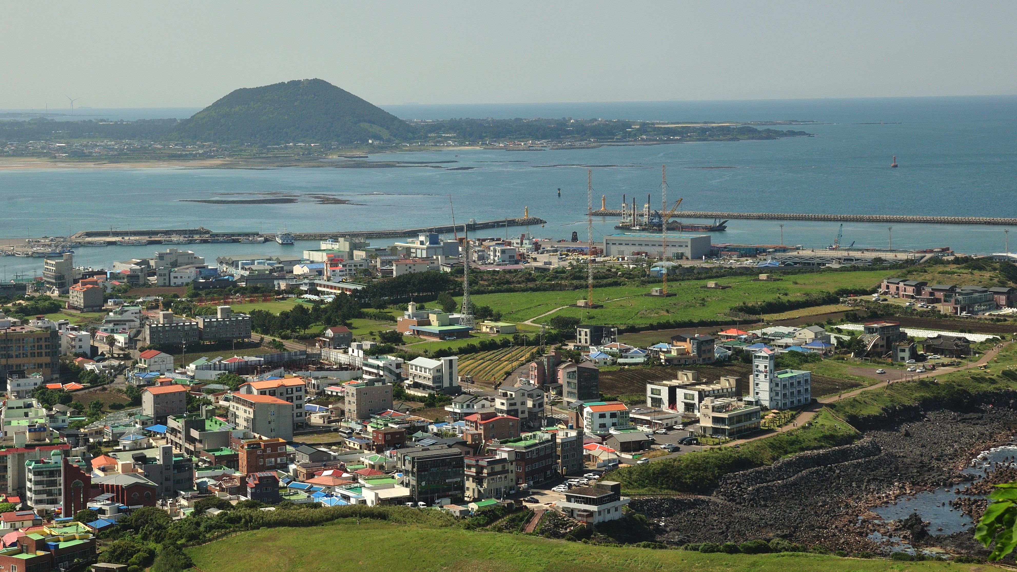Aerial View of Coastal Town on Jeju Island · Free Stock Photo