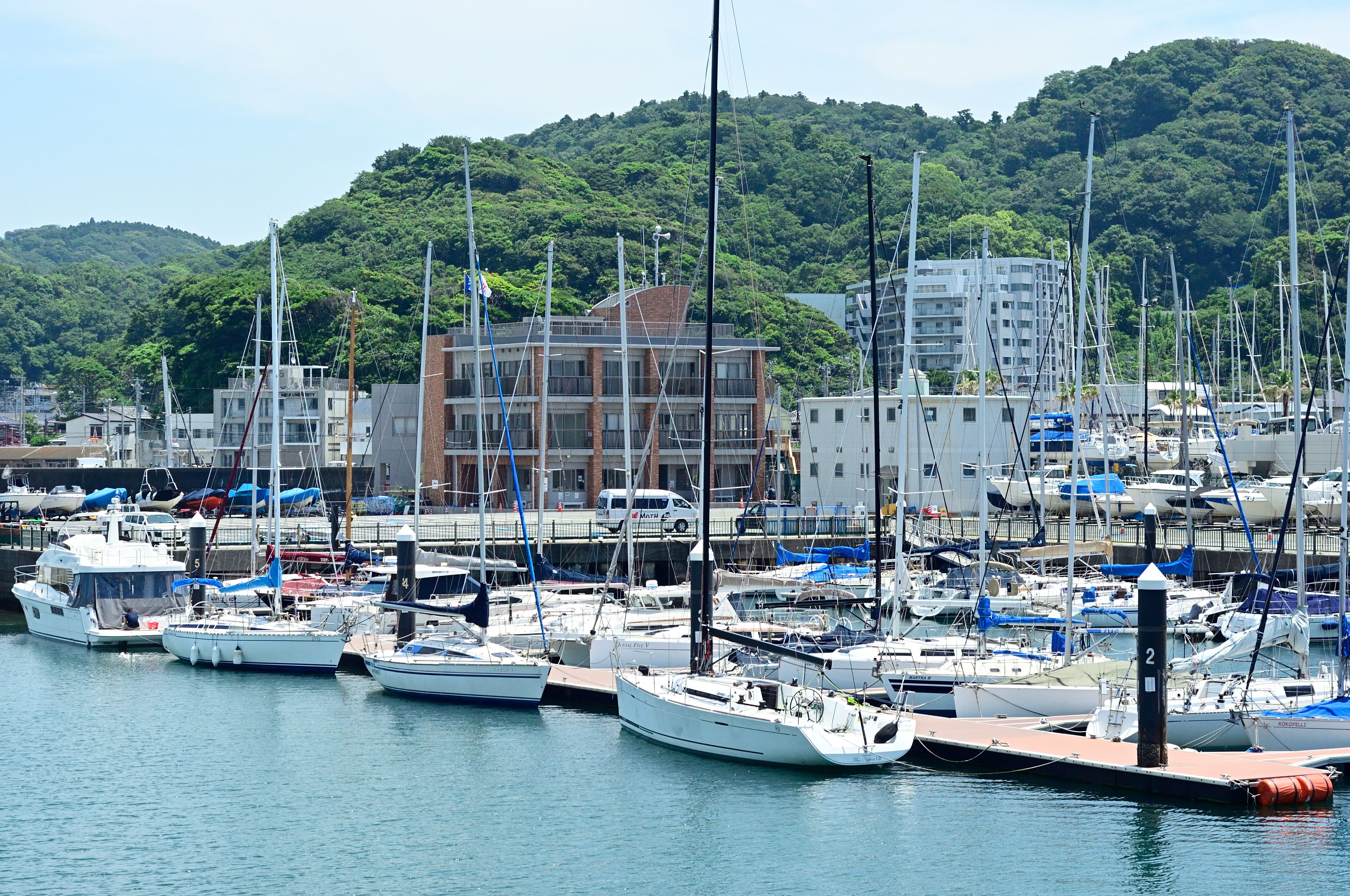 Scenic Marina in Japan with Sailboats and Green Hills · Free Stock Photo