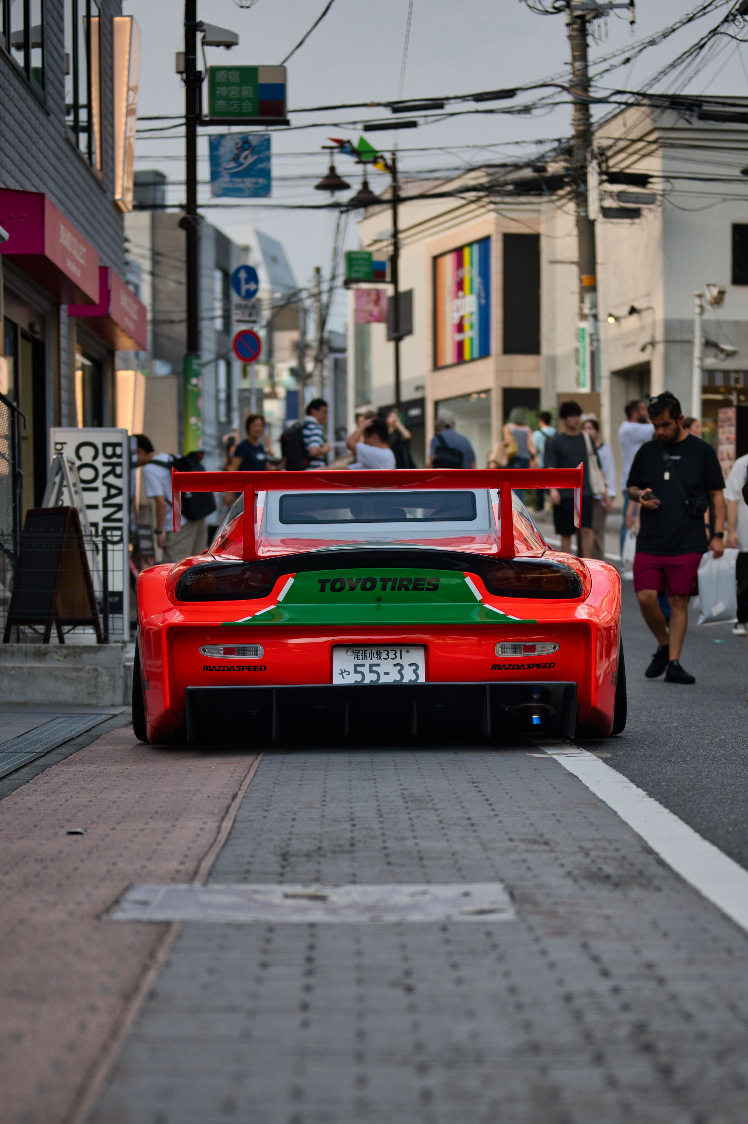 Vibrantly Colored Tuning Car on Tokyo Street · Free Stock Photo