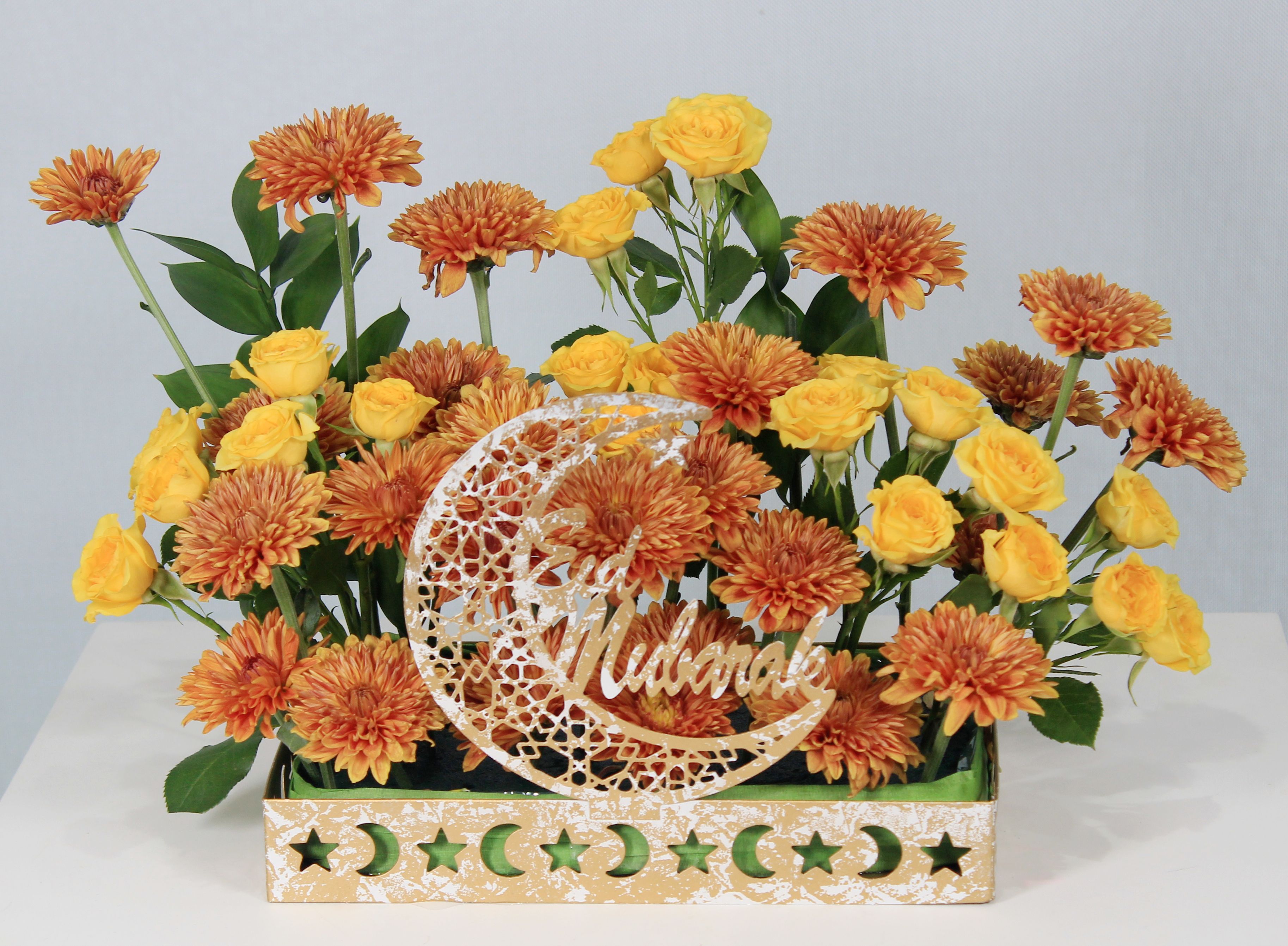 Vibrant Eid Mubarak Floral Arrangement Display · Free Stock Photo