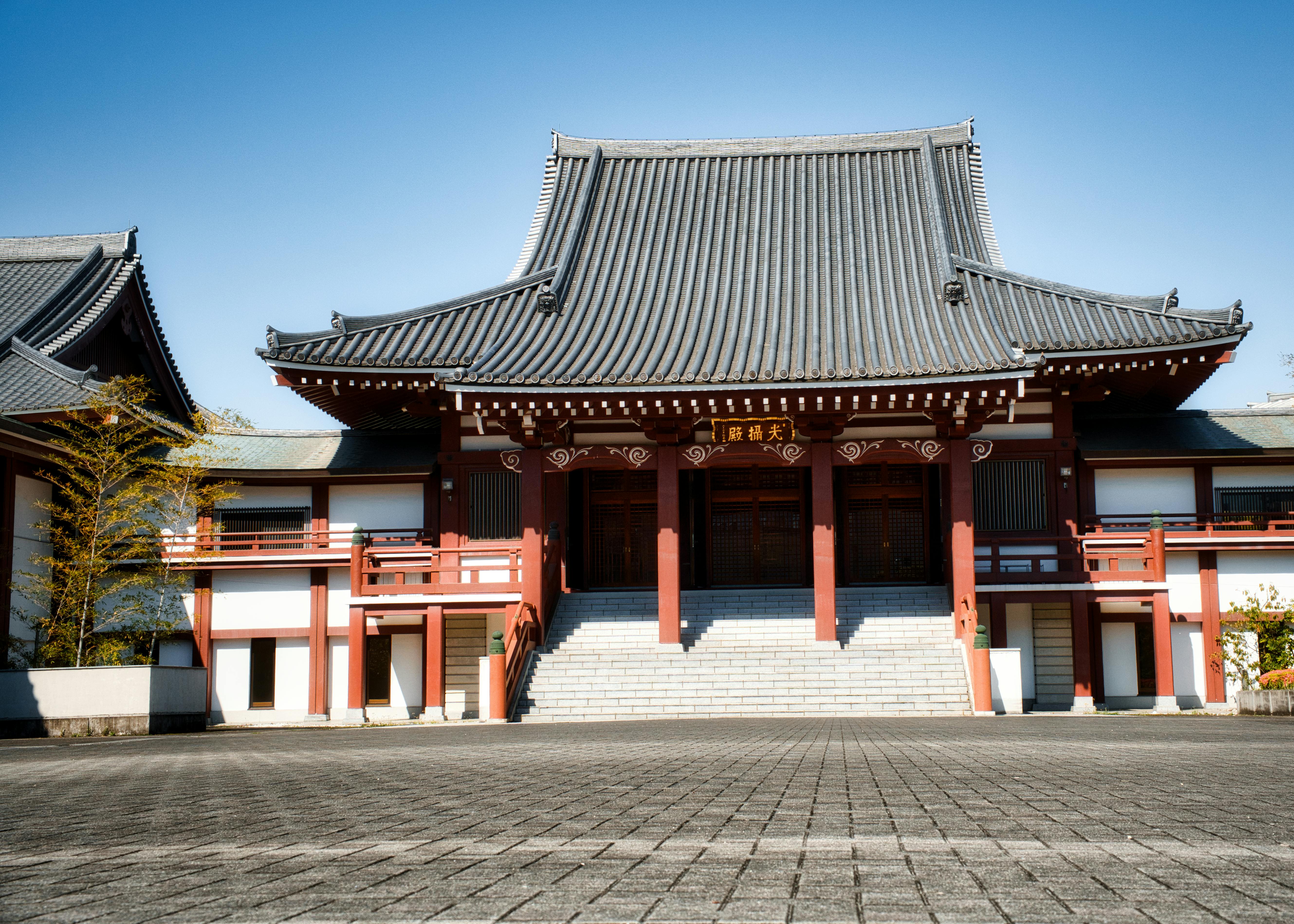 Tokyo Tower Behind Black and White Dojo Building during Daytime · Free ...