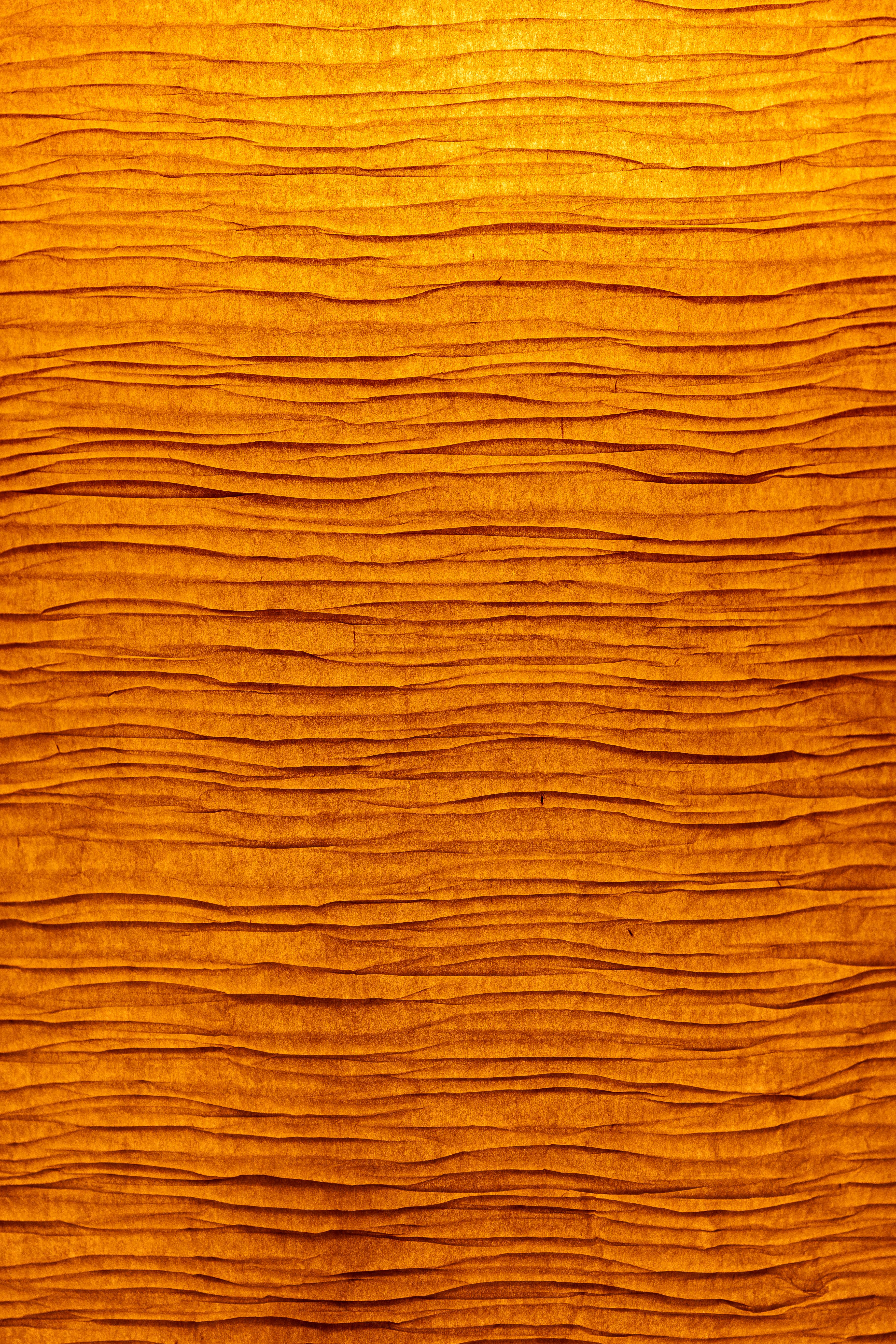 Papier Orange Texturé Avec éclairage Chaleureux · Photo gratuite