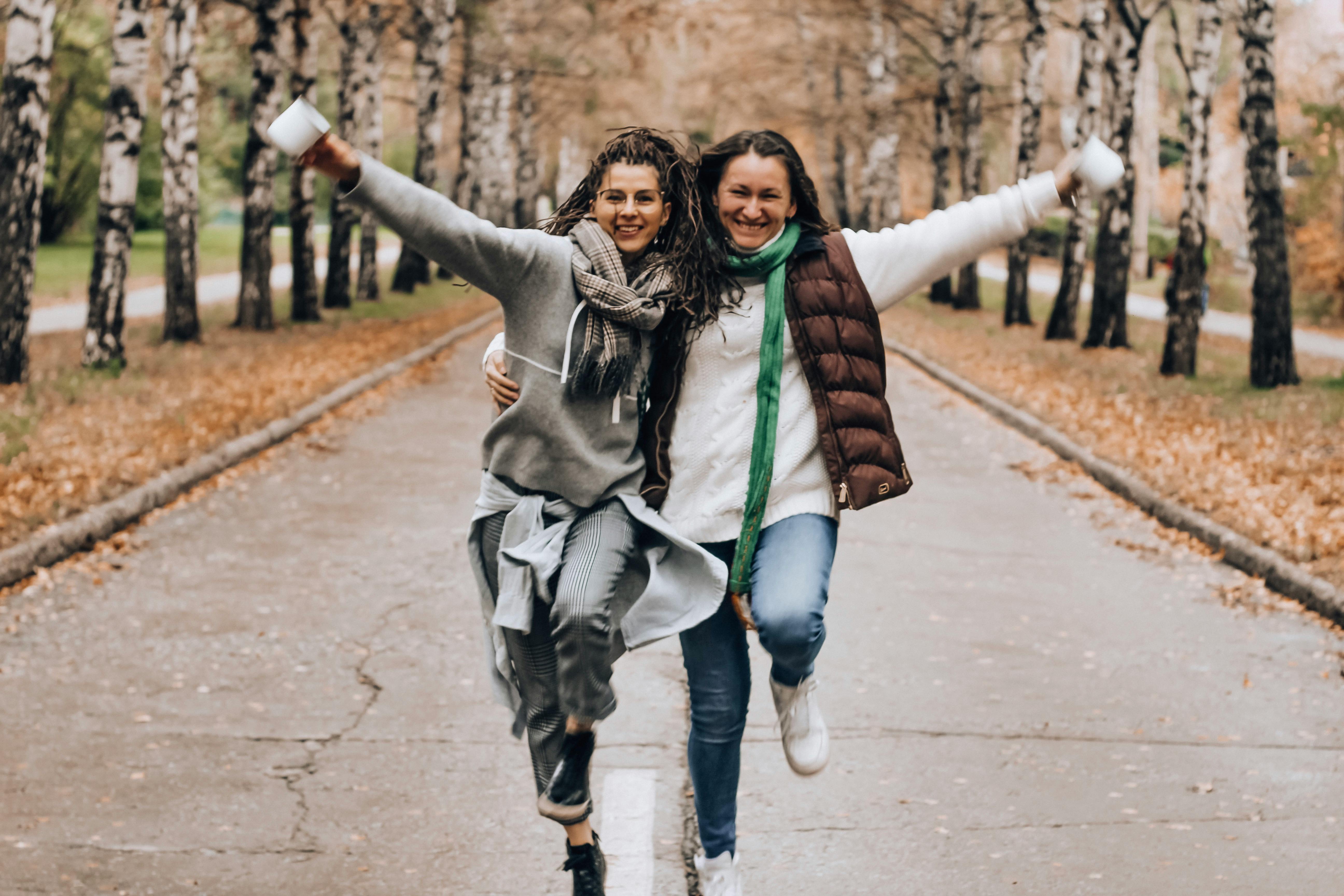 Two Women Walking Together · Free Stock Photo