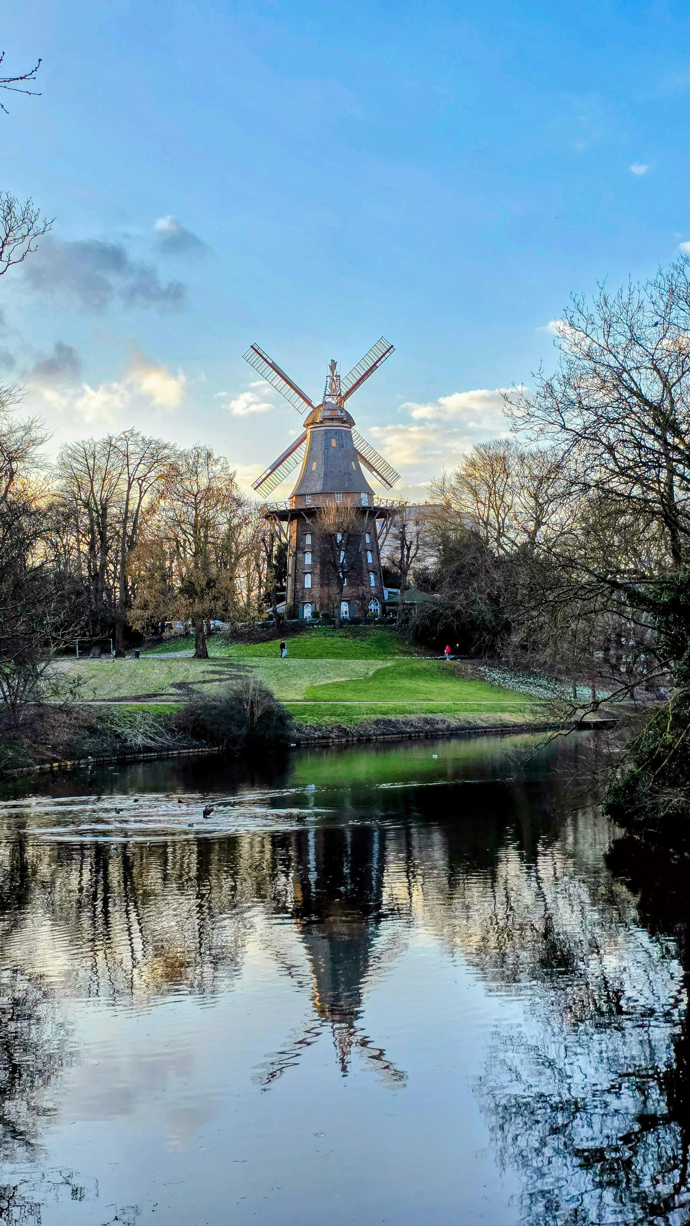 Scenic Windmill Reflection in Bremen Park · Free Stock Photo