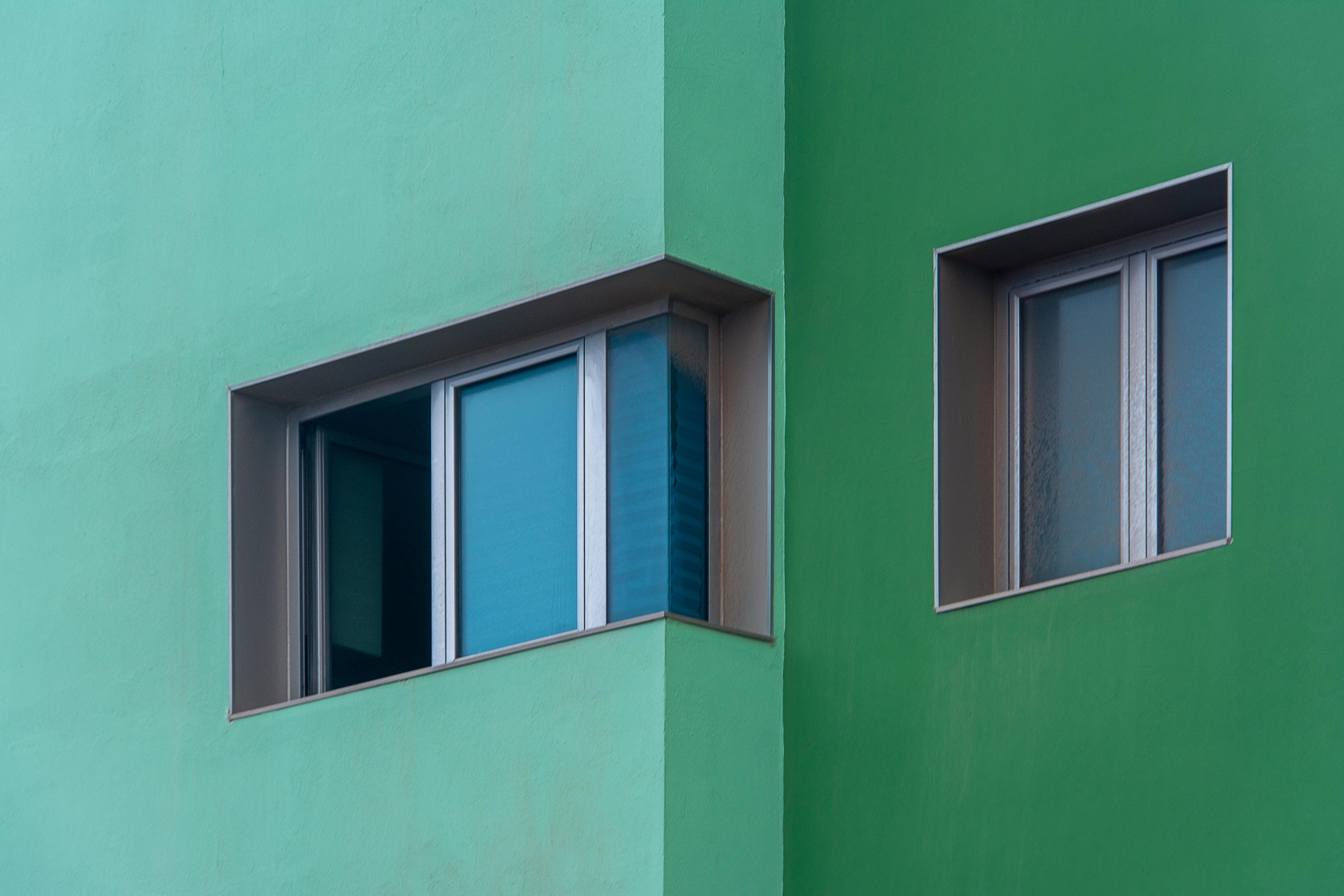 Modern Green Building Facade with Windows · Free Stock Photo