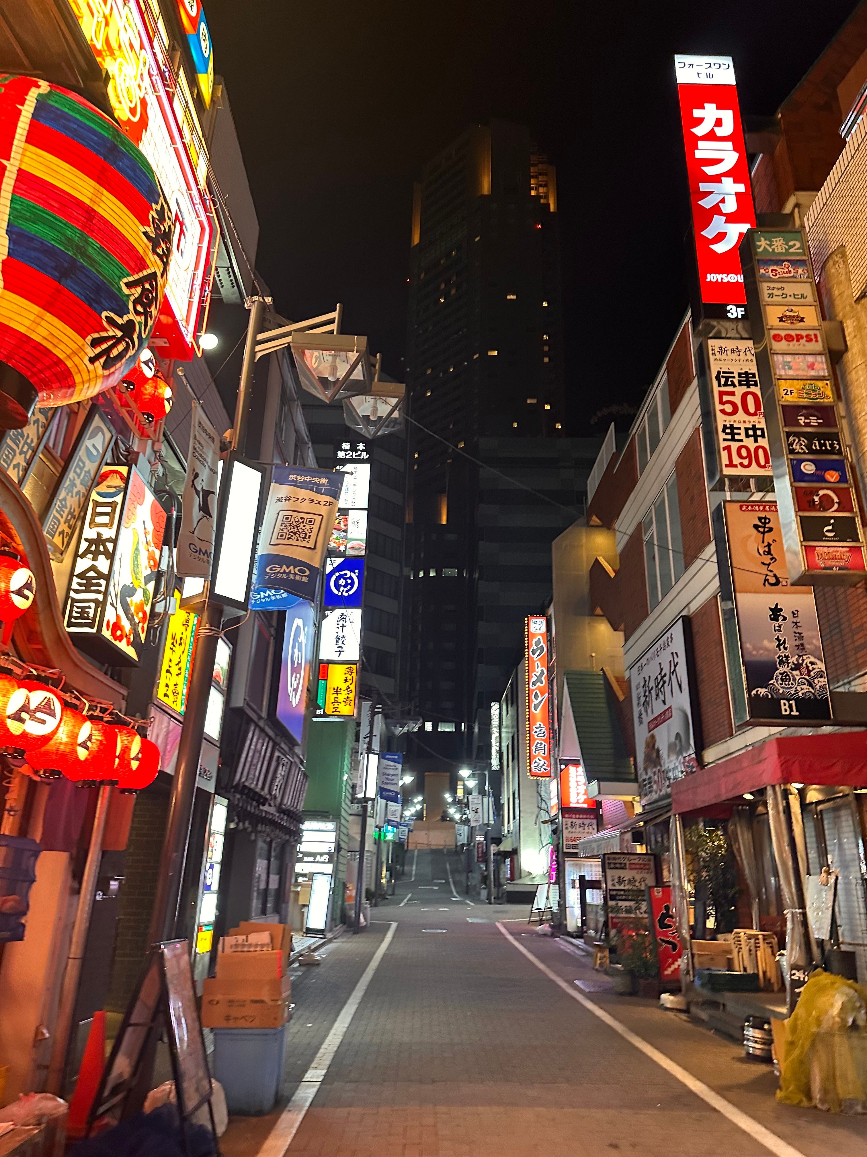 Vibrant Nighttime Street in Japan with Neon Lights · Free Stock Photo