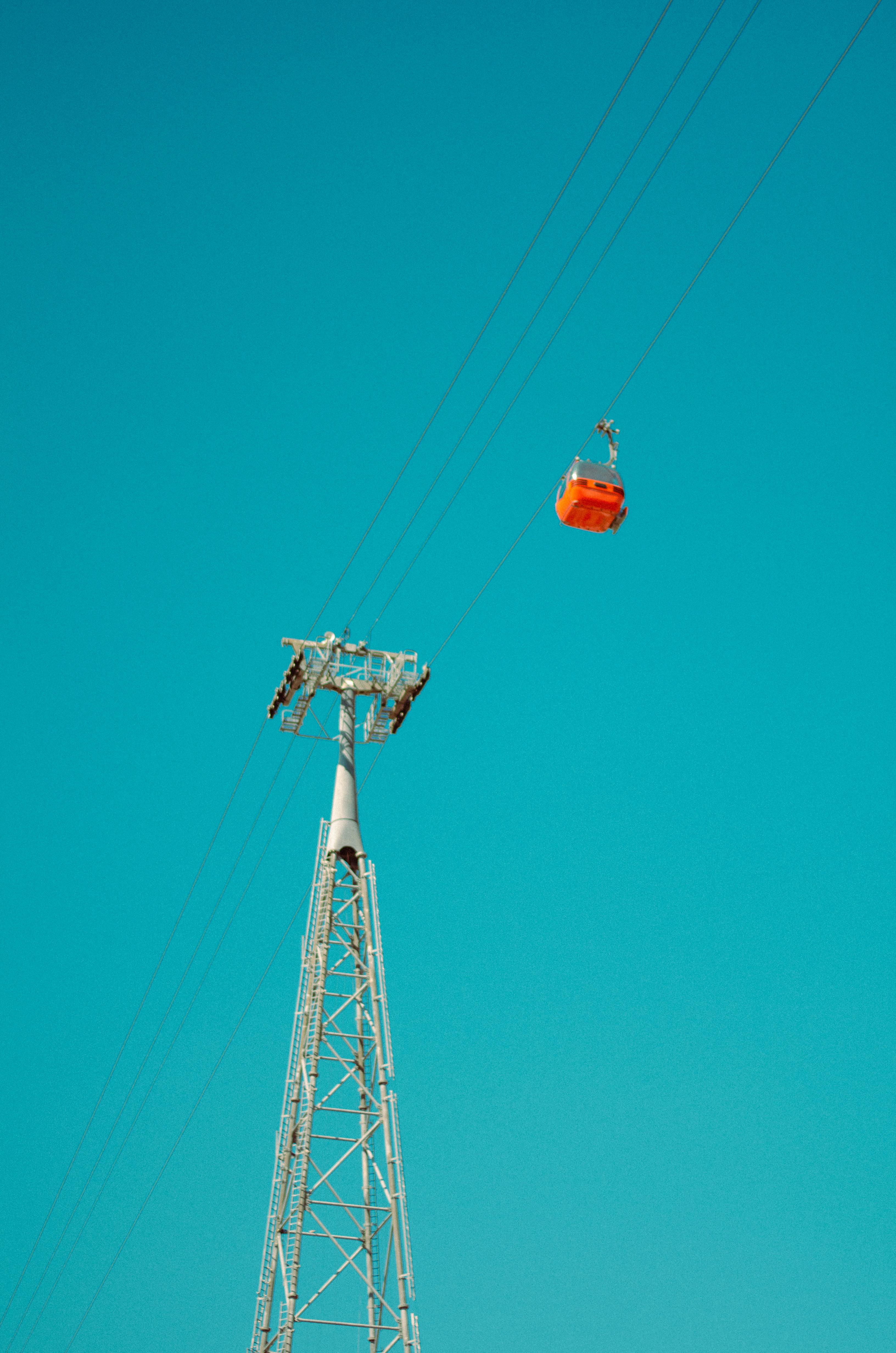 Orange Cable Car Against Clear Blue Sky · Free Stock Photo