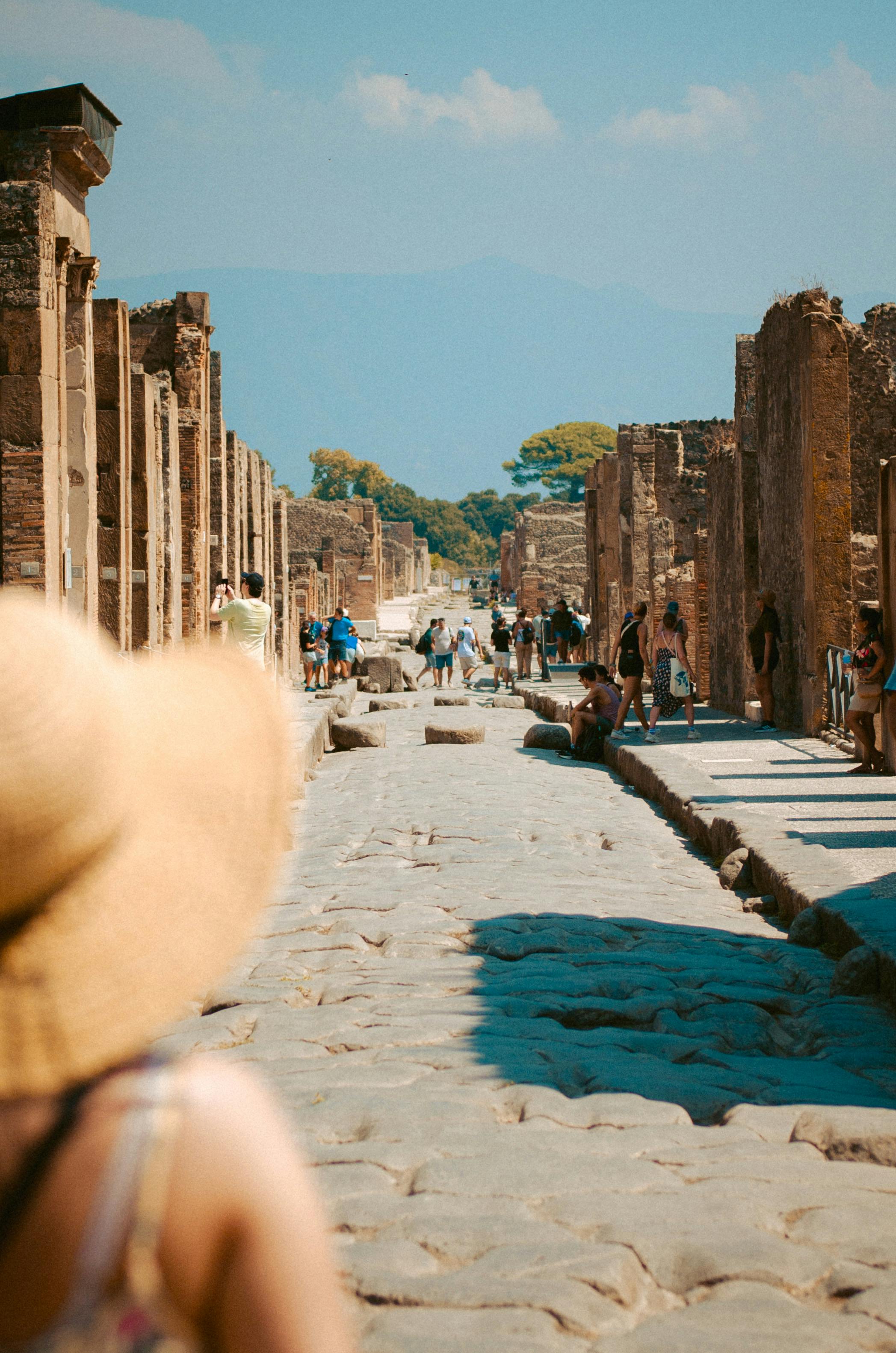 Tourists Exploring Ancient Ruins of Pompeii · Free Stock Photo