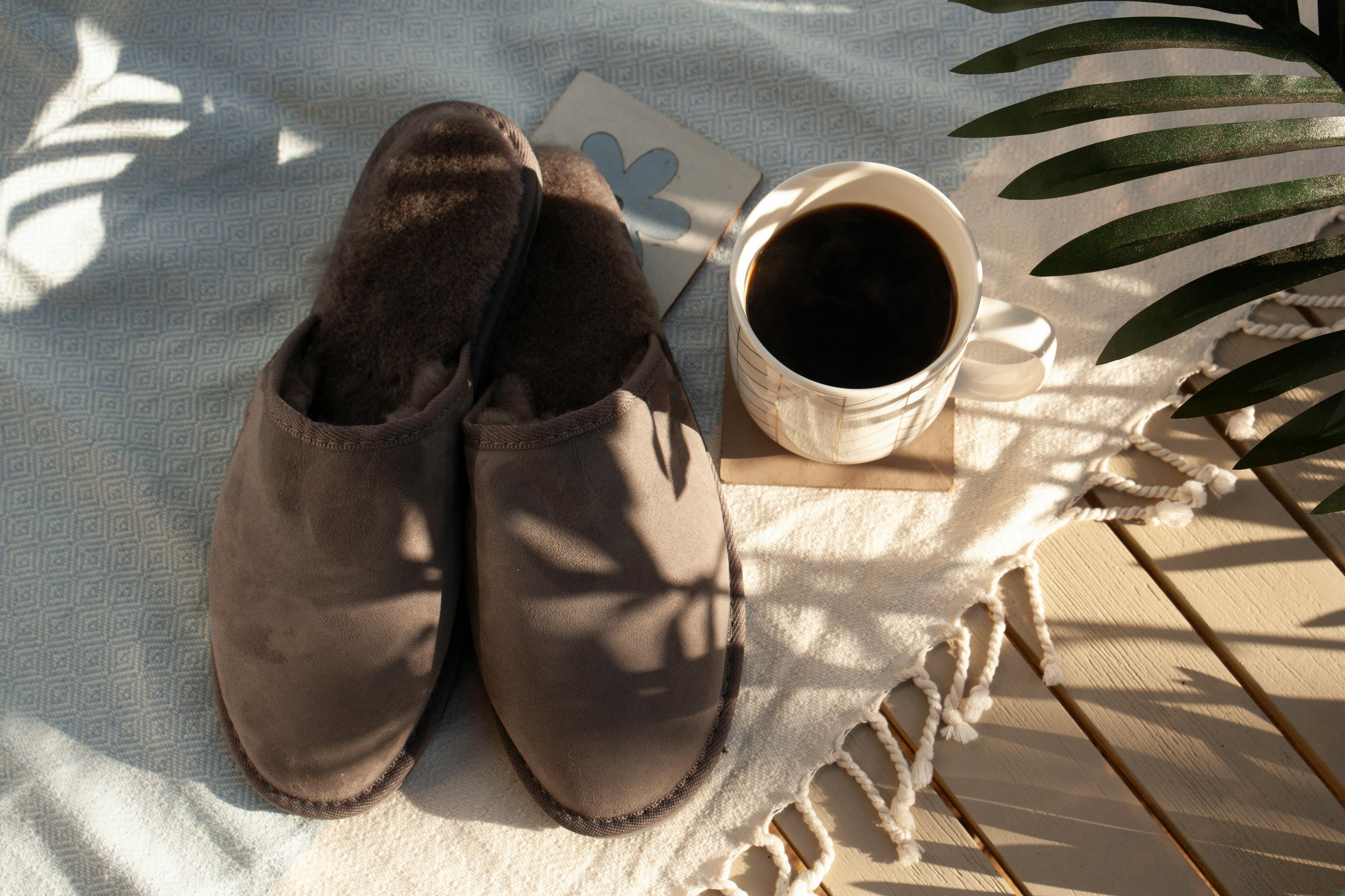 Cozy Morning Slippers and Coffee on Sunlit Deck · Free Stock Photo