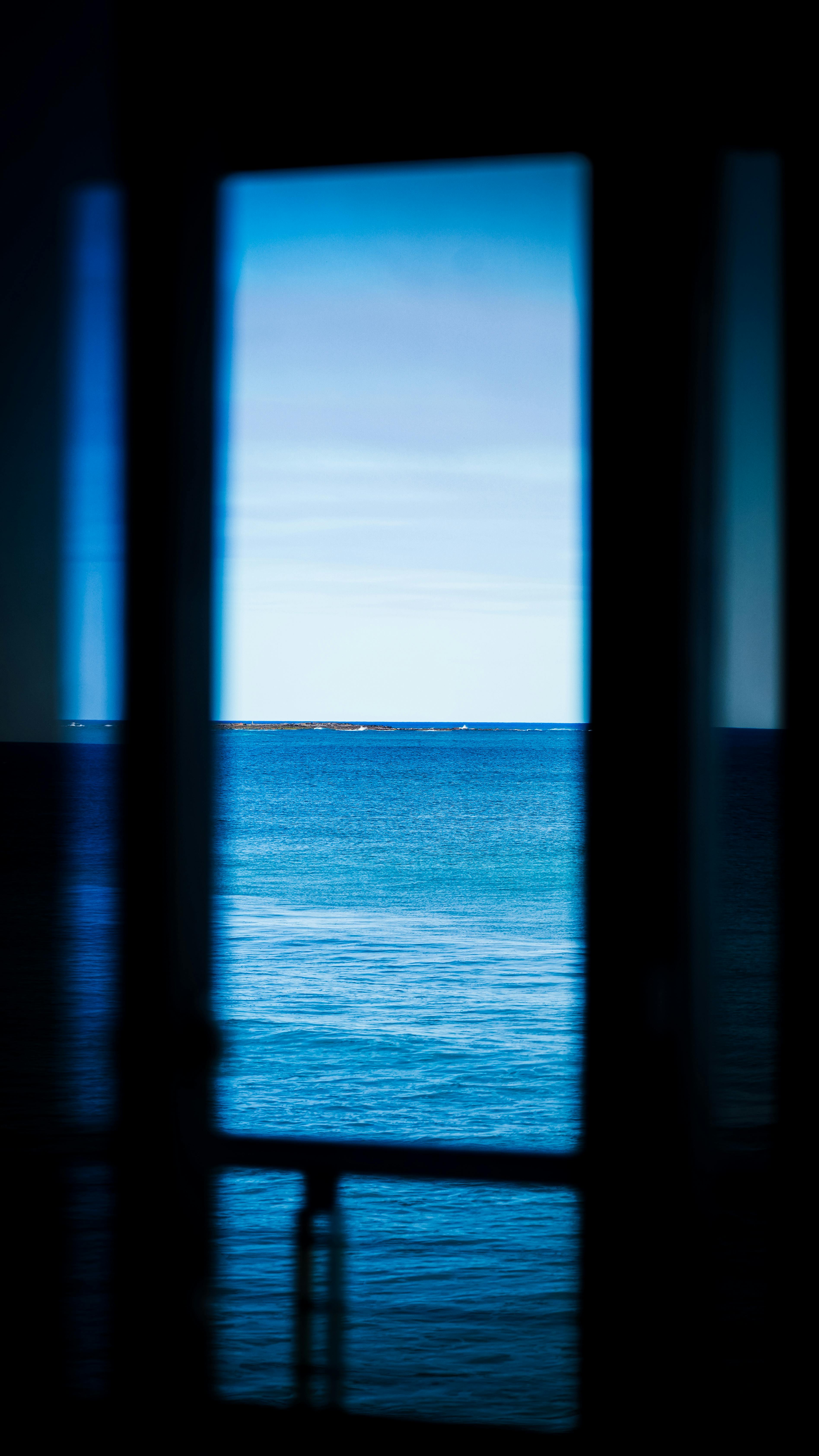 Framed Ocean View Through Window · Free Stock Photo