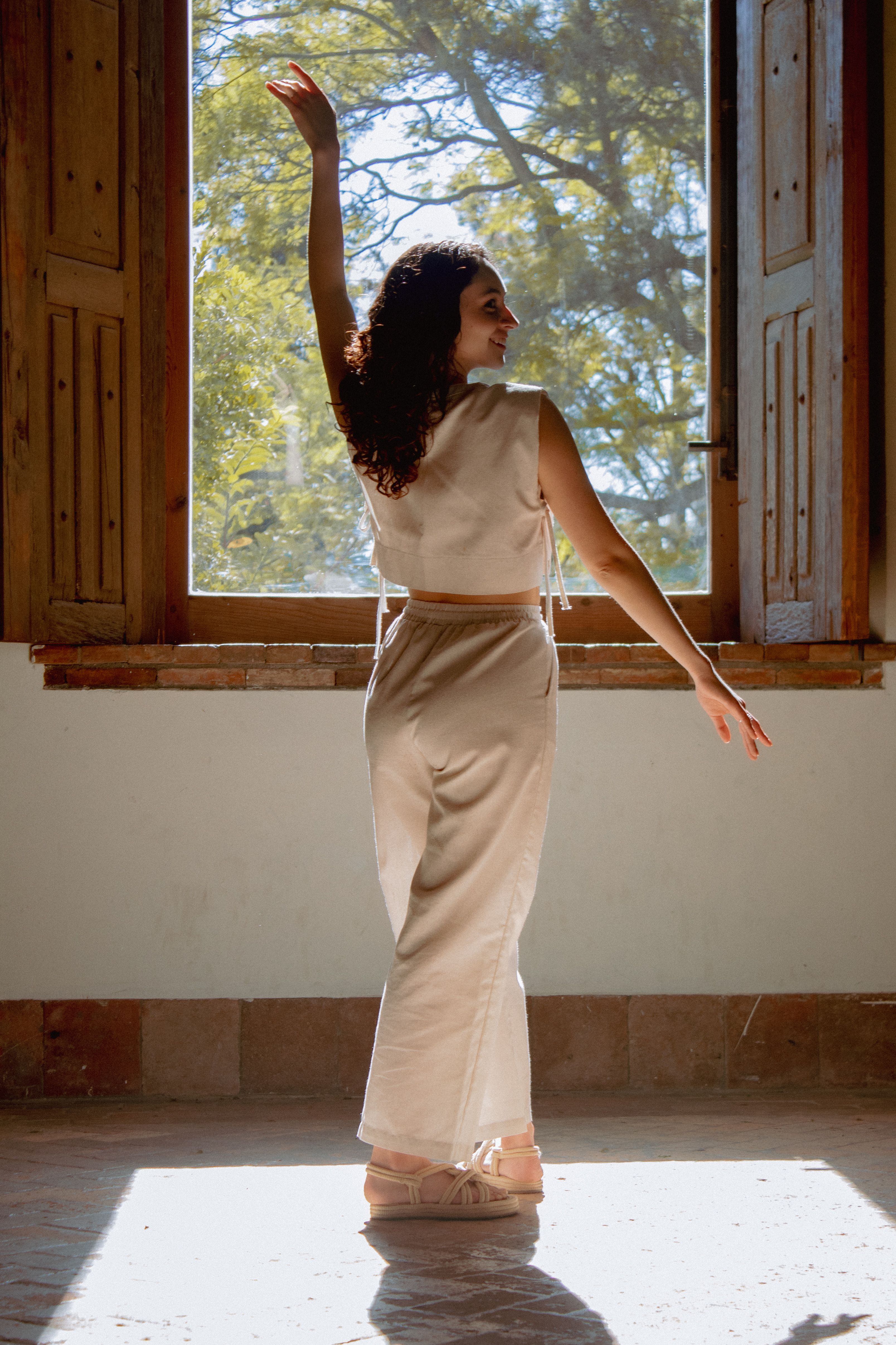 Graceful Ballet Pose by Sunlit Window · Free Stock Photo